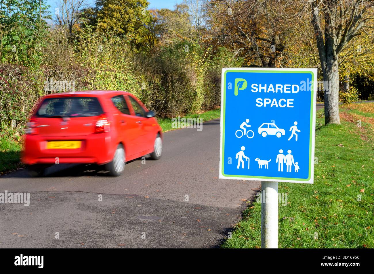 A car passing a Shared Space sign in Pollok Country Park, Glasgow ...