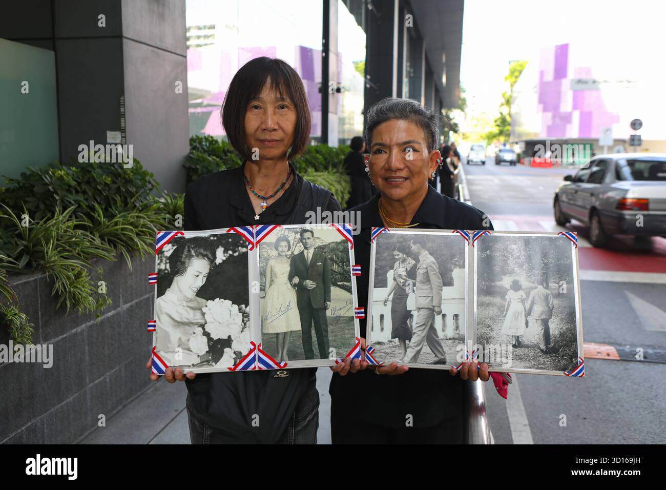 People holds mourning a portrait of the late Her Majesty Queen Sirikit ...