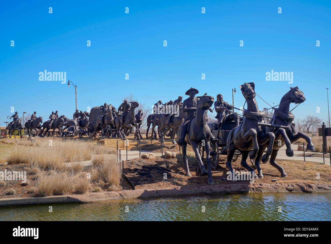 Bronze wagon team and riders beside the Bricktown Canal at the ...