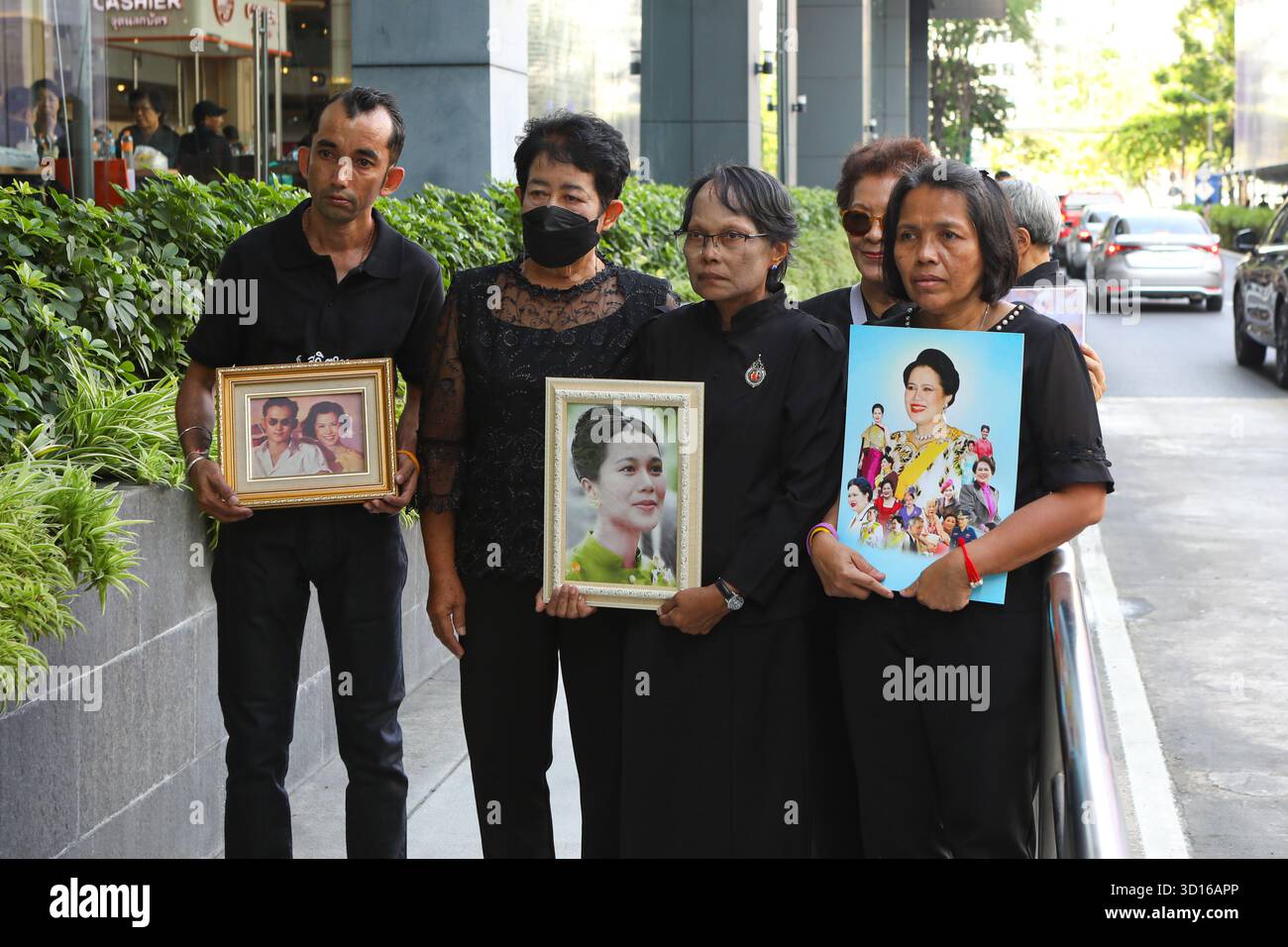 People holds mourning a portrait of the late Her Majesty Queen Sirikit ...
