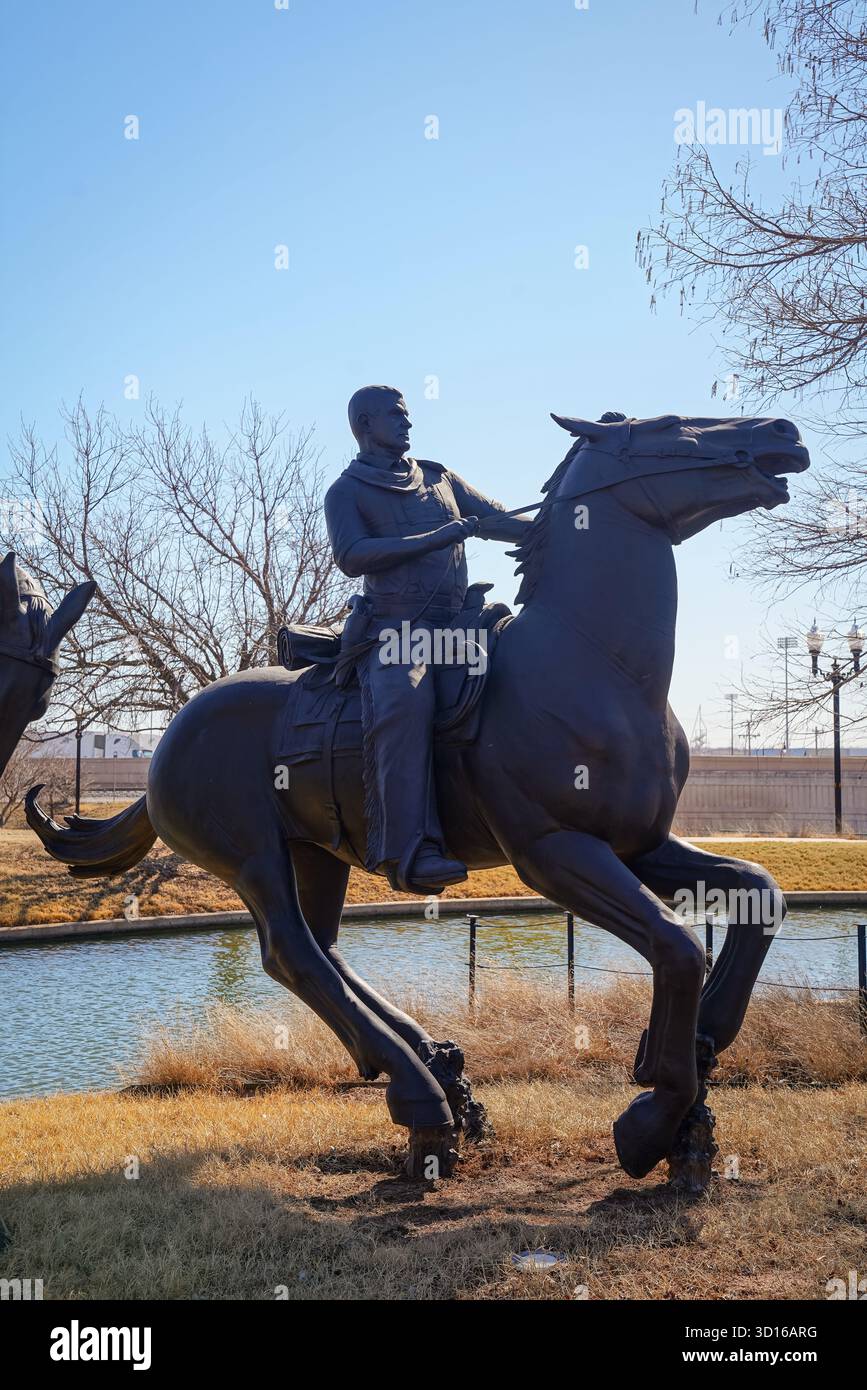 Bronze horse and rider statue in full sunlight at the Centennial Land ...