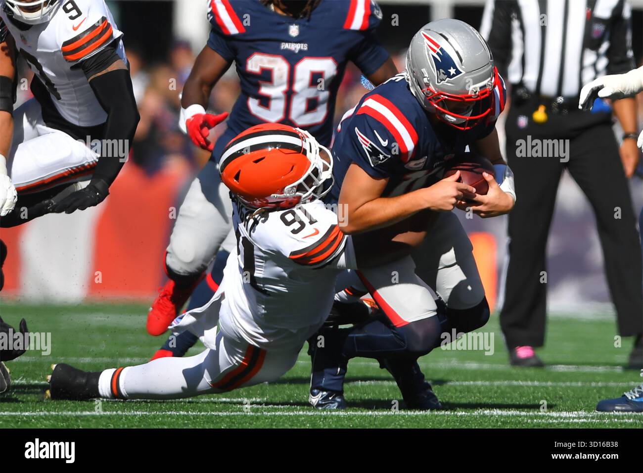 New England Patriots quarterback Drake Maye (10) is sacked by Cleveland ...