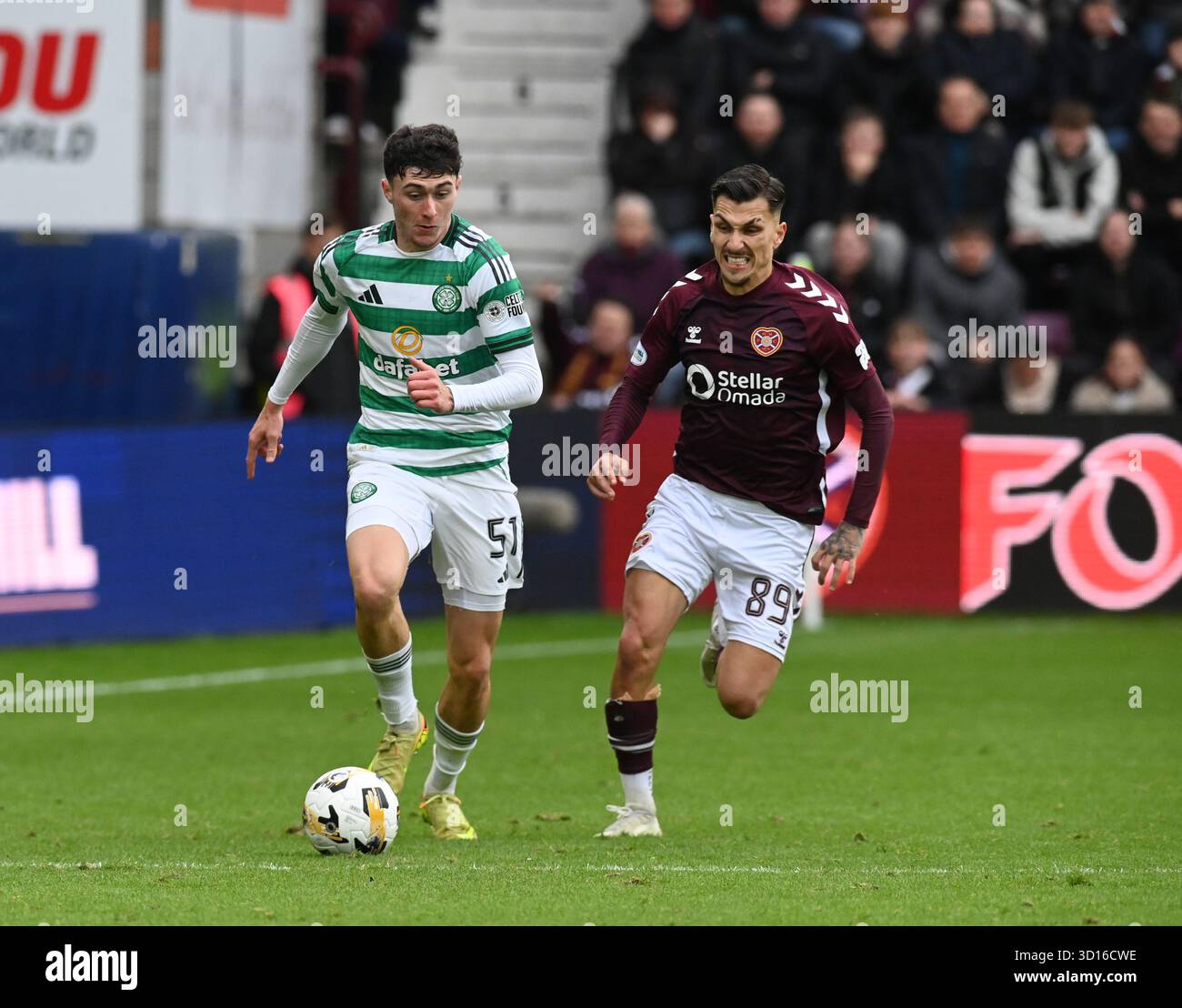 Colby donovan of celtic with alexandros kyziridis of hearts hi-res ...
