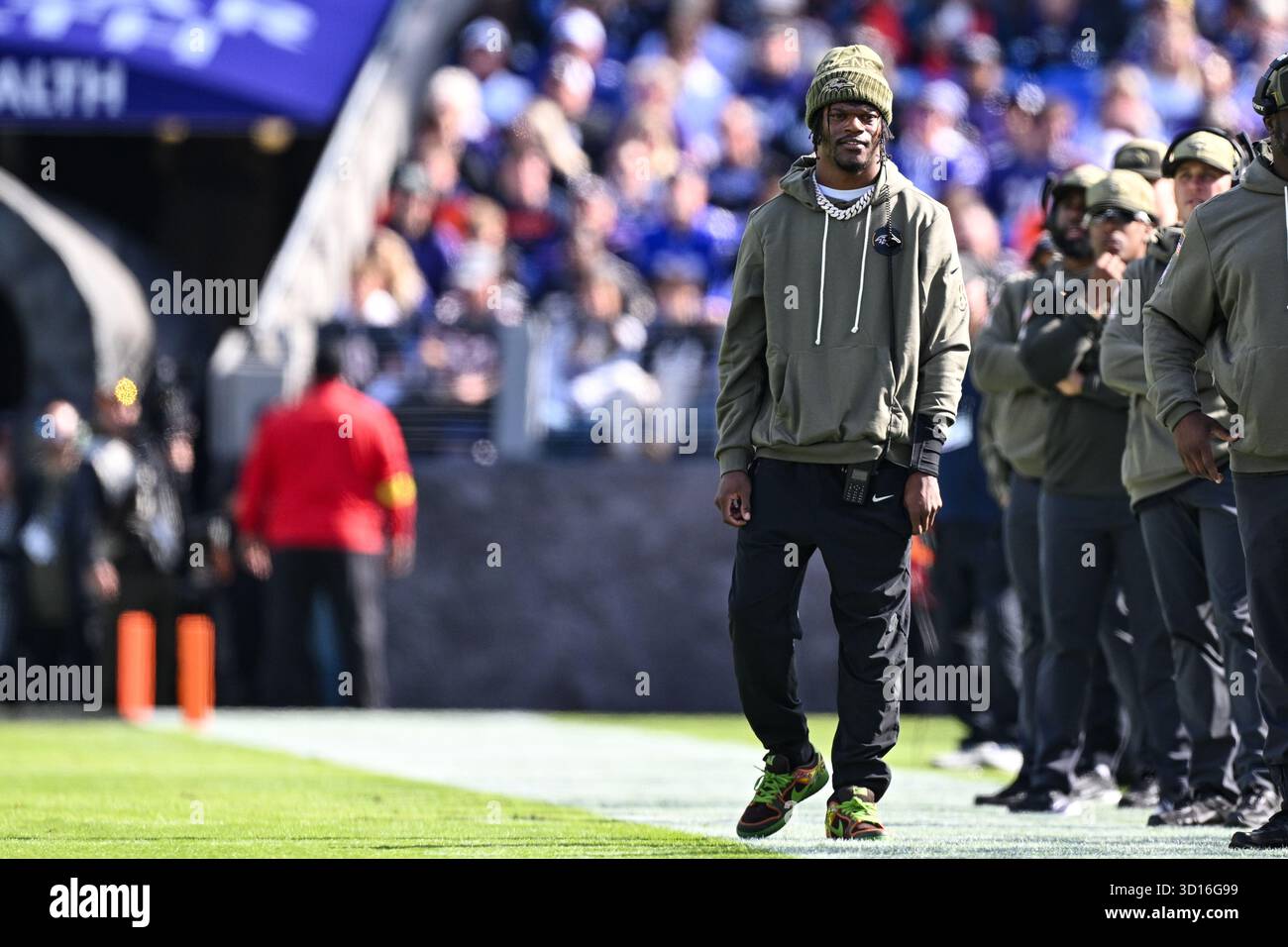 Baltimore Ravens quarterback Lamar Jackson looks on from the sideline ...
