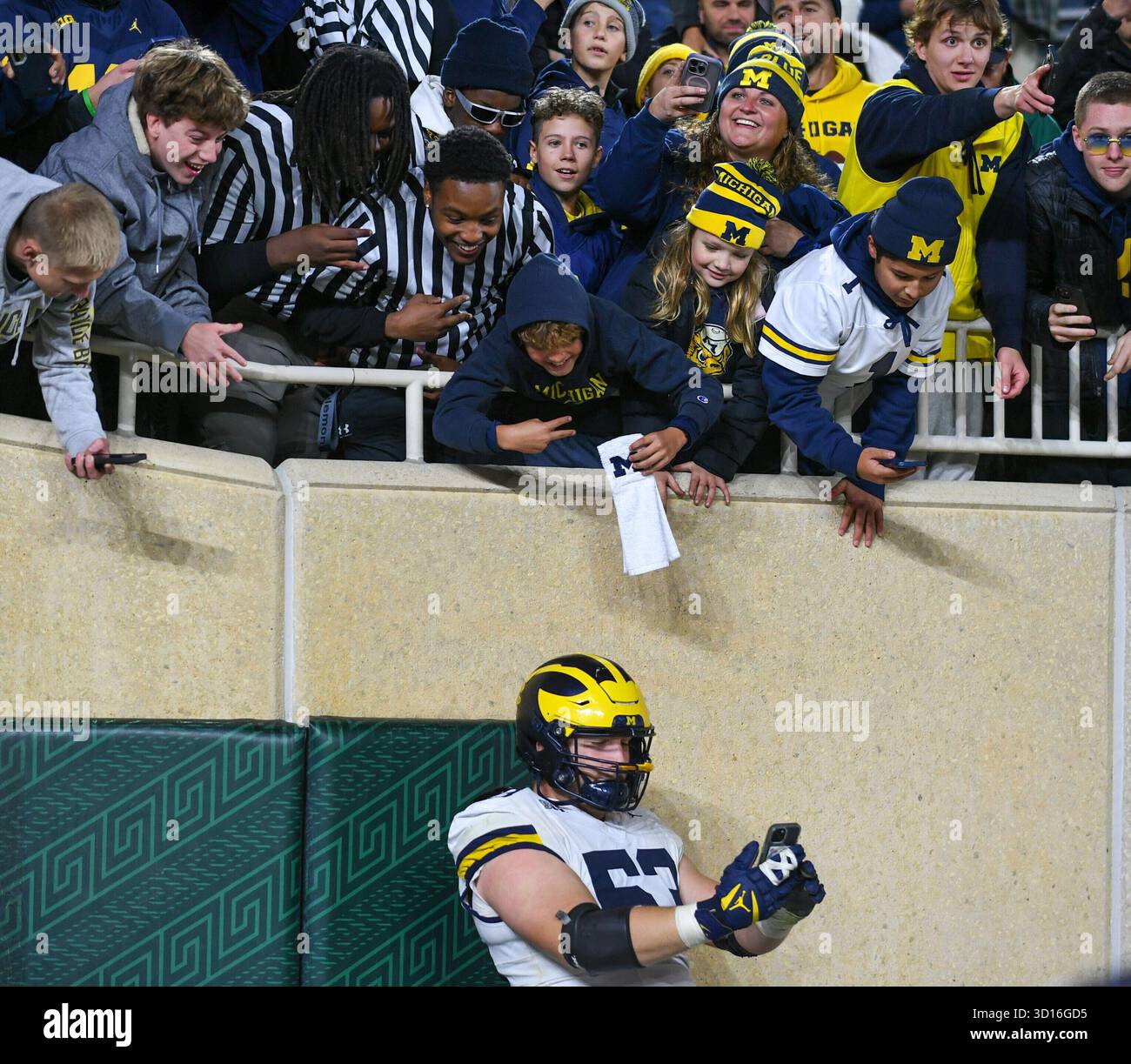 October 25, 2025: Michigan OL Jake Guarnera (53) poses to take photos ...