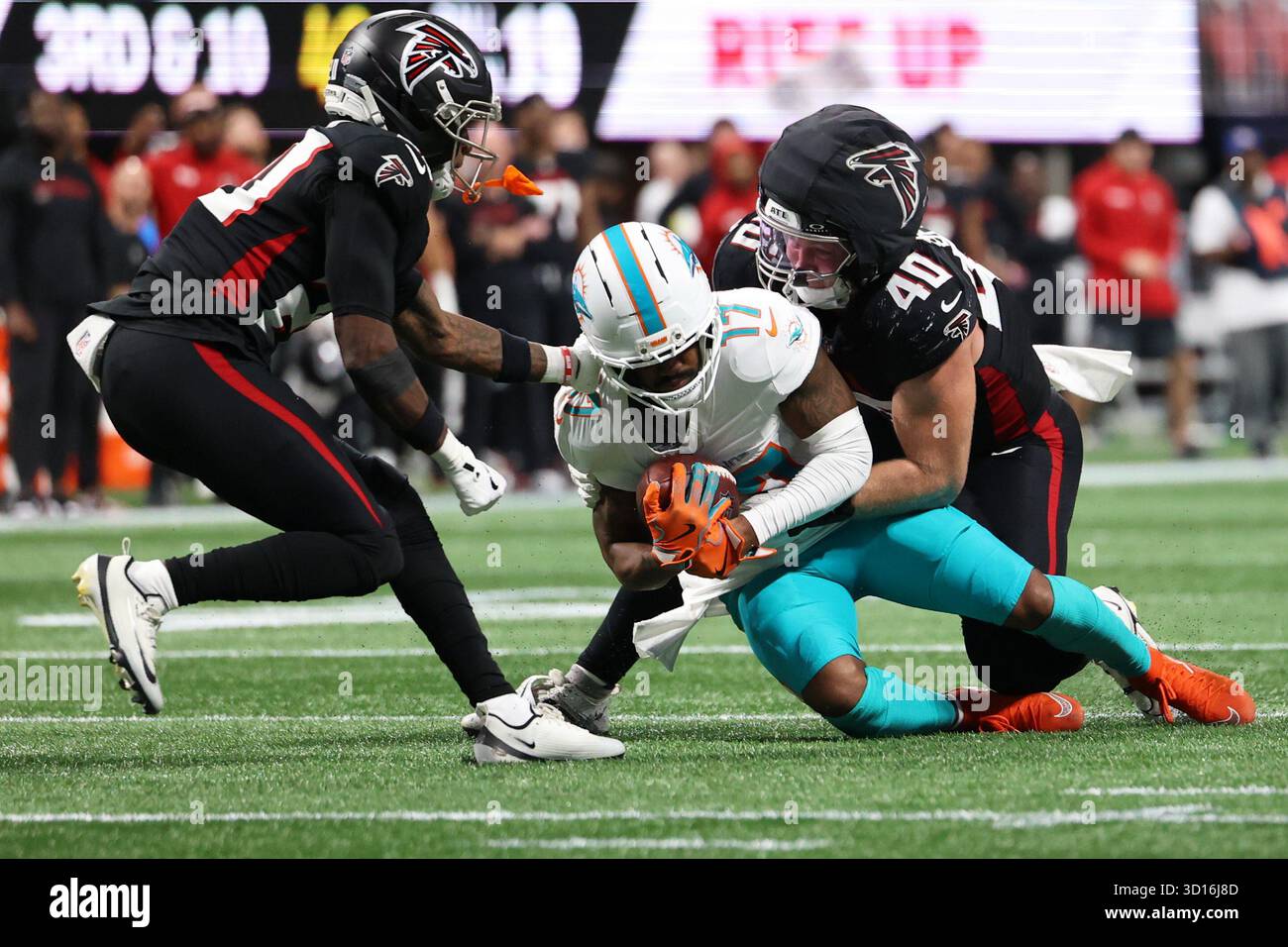 Miami Dolphins wide receiver Jaylen Waddle (17) is tackled by Atlanta ...