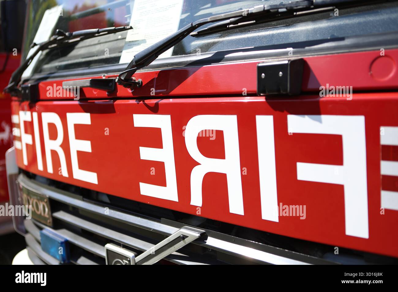 Fire lettering painted in reverse on front of fire engine Stock Photo ...