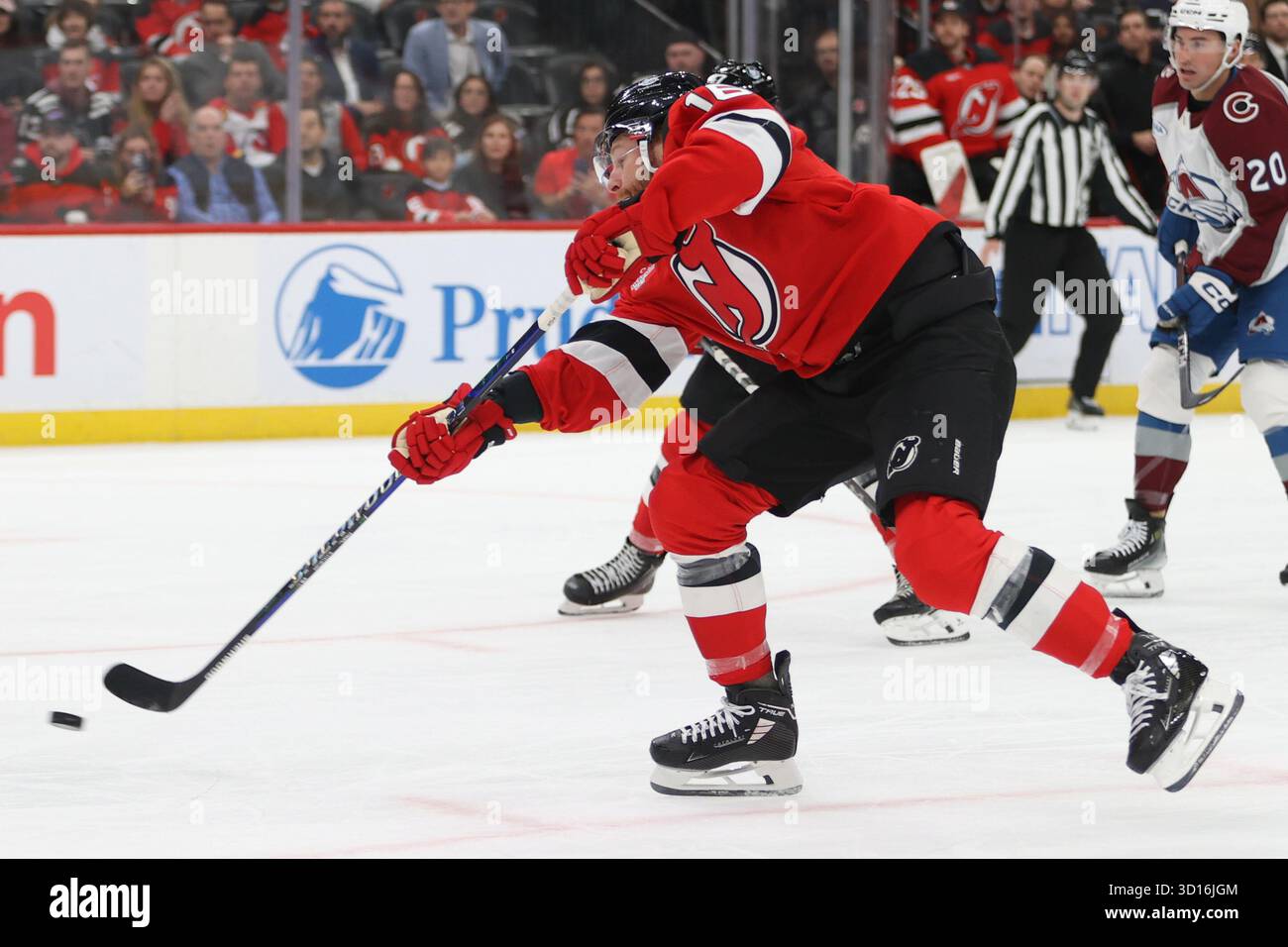 New Jersey Devils' Connor Brown shoots the puck and scores a goal ...