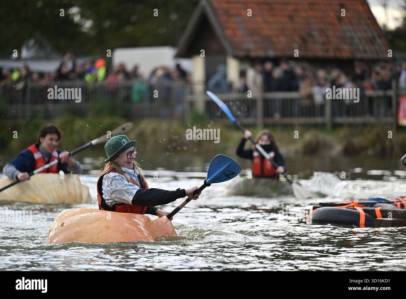 The 'Pompoenregatta' boat race in scooped out giant pumpkins, in ...