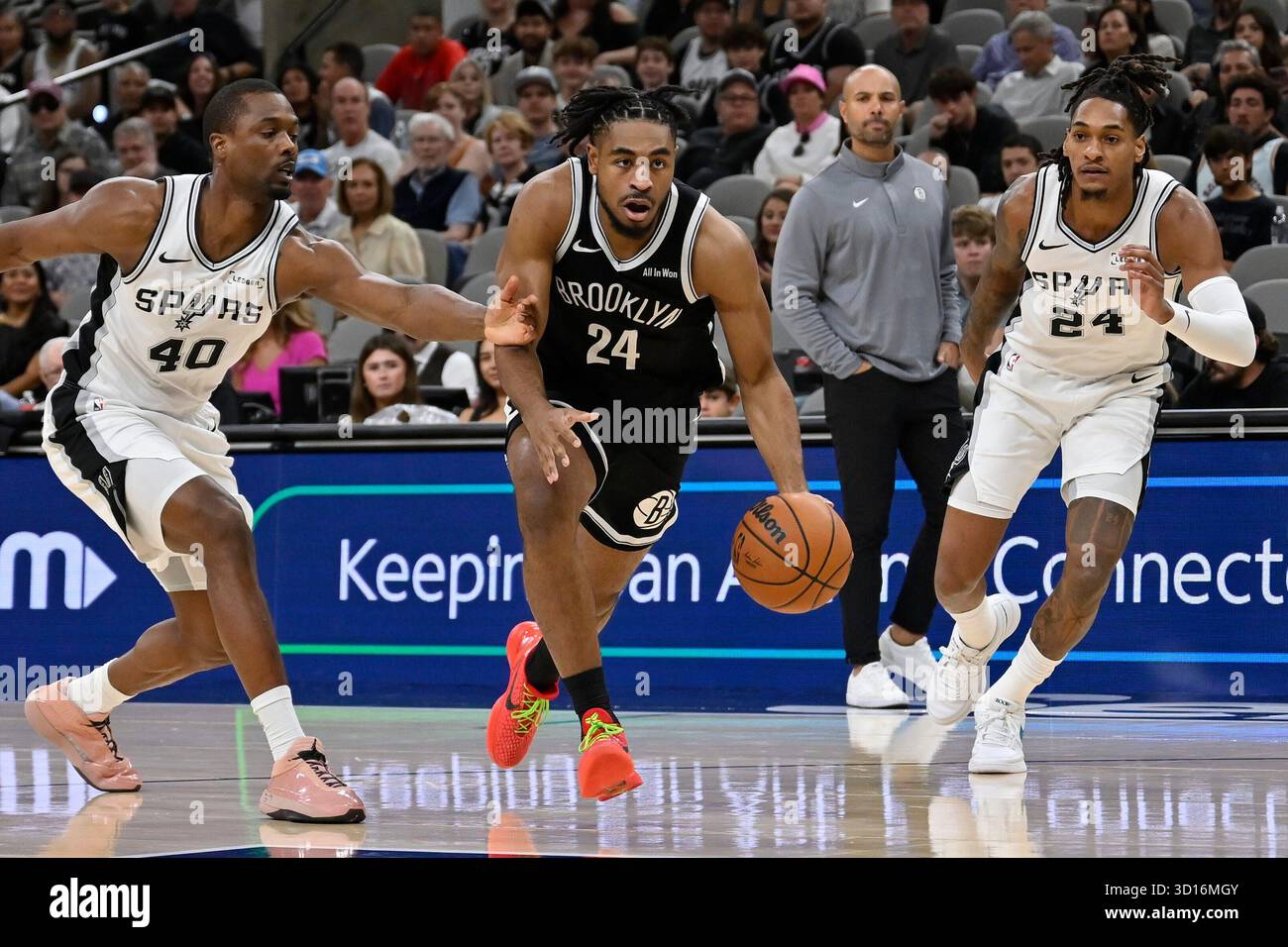 Brooklyn Nets guard Cam Thomas, center, drives against San Antonio ...