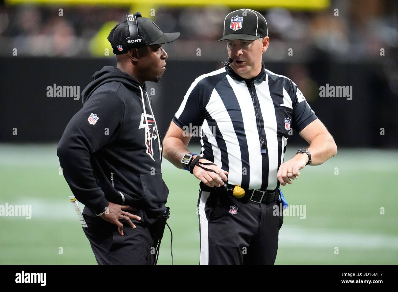 Atlanta Falcons head coach Raheem Morris, left, talks with an official ...