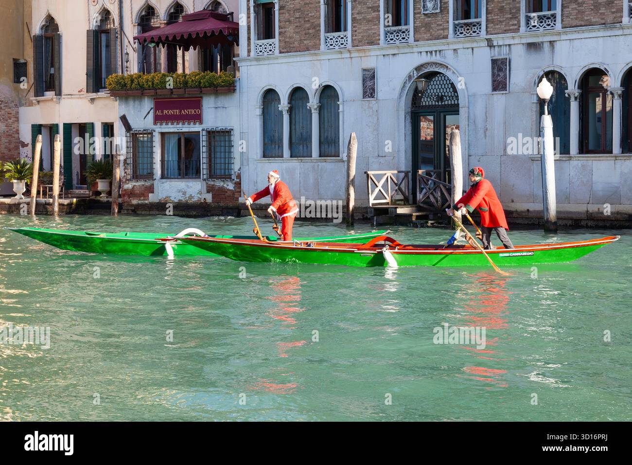 Rowers in Father Christmas, Santa outfits rowing green boats, Grand ...