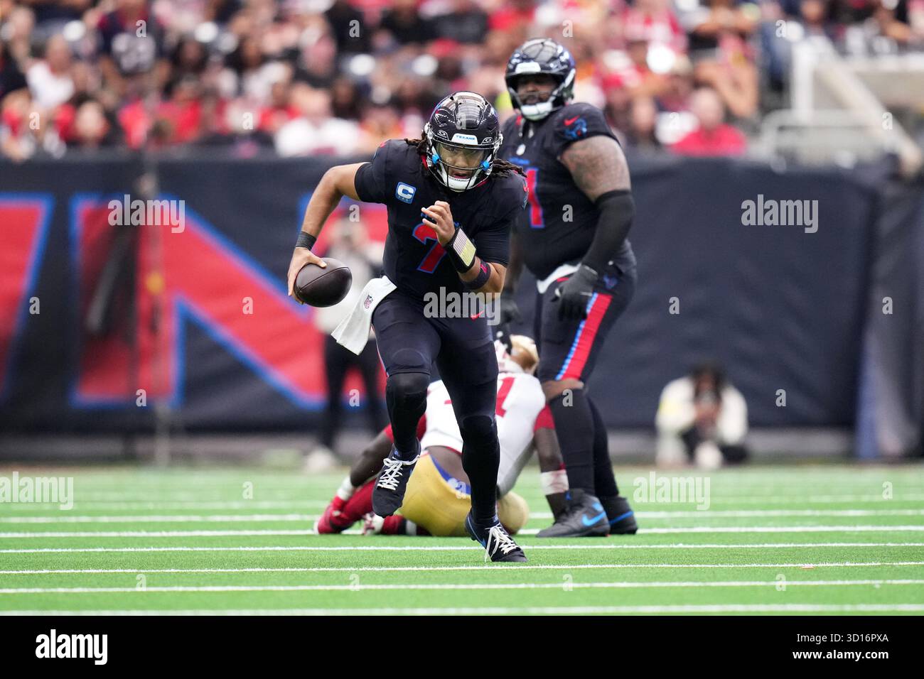 Houston Texans quarterback C.J. Stroud runs with the ball during the ...