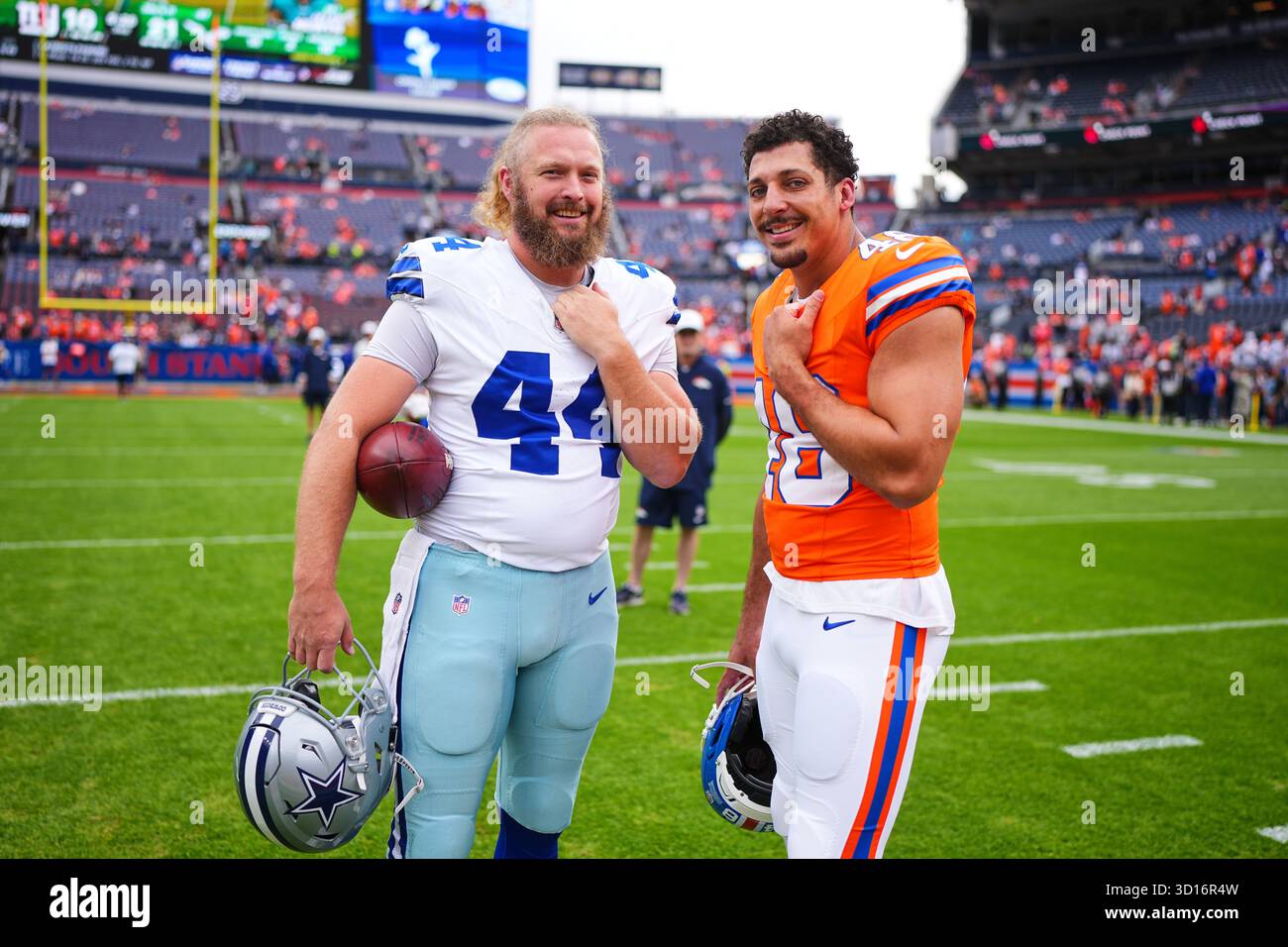 Dallas Cowboys long snapper Trent Sieg (44) and Denver Broncos long ...