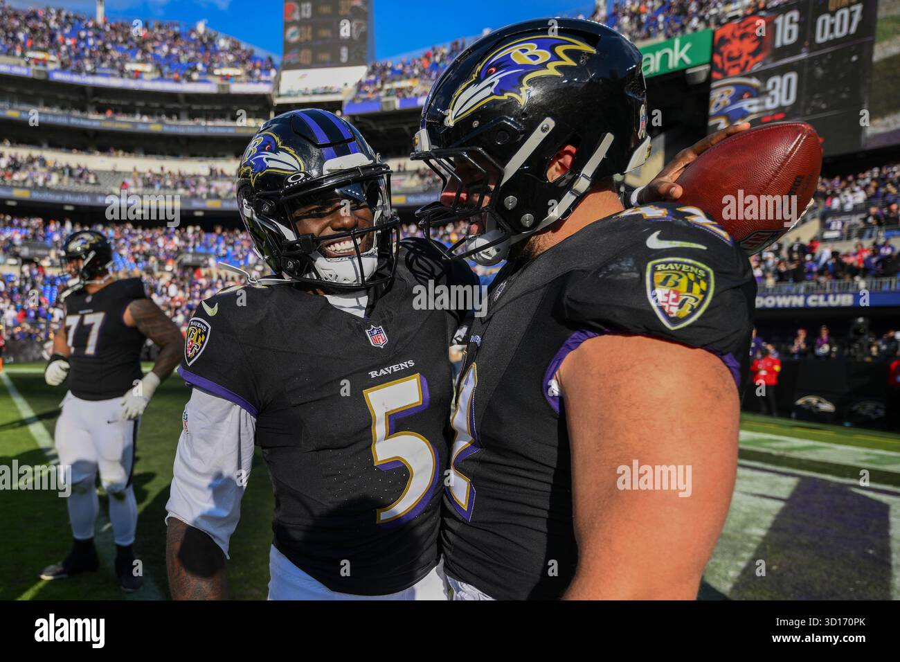 Baltimore Ravens quarterback Tyler Huntley (5), left, and fullback ...