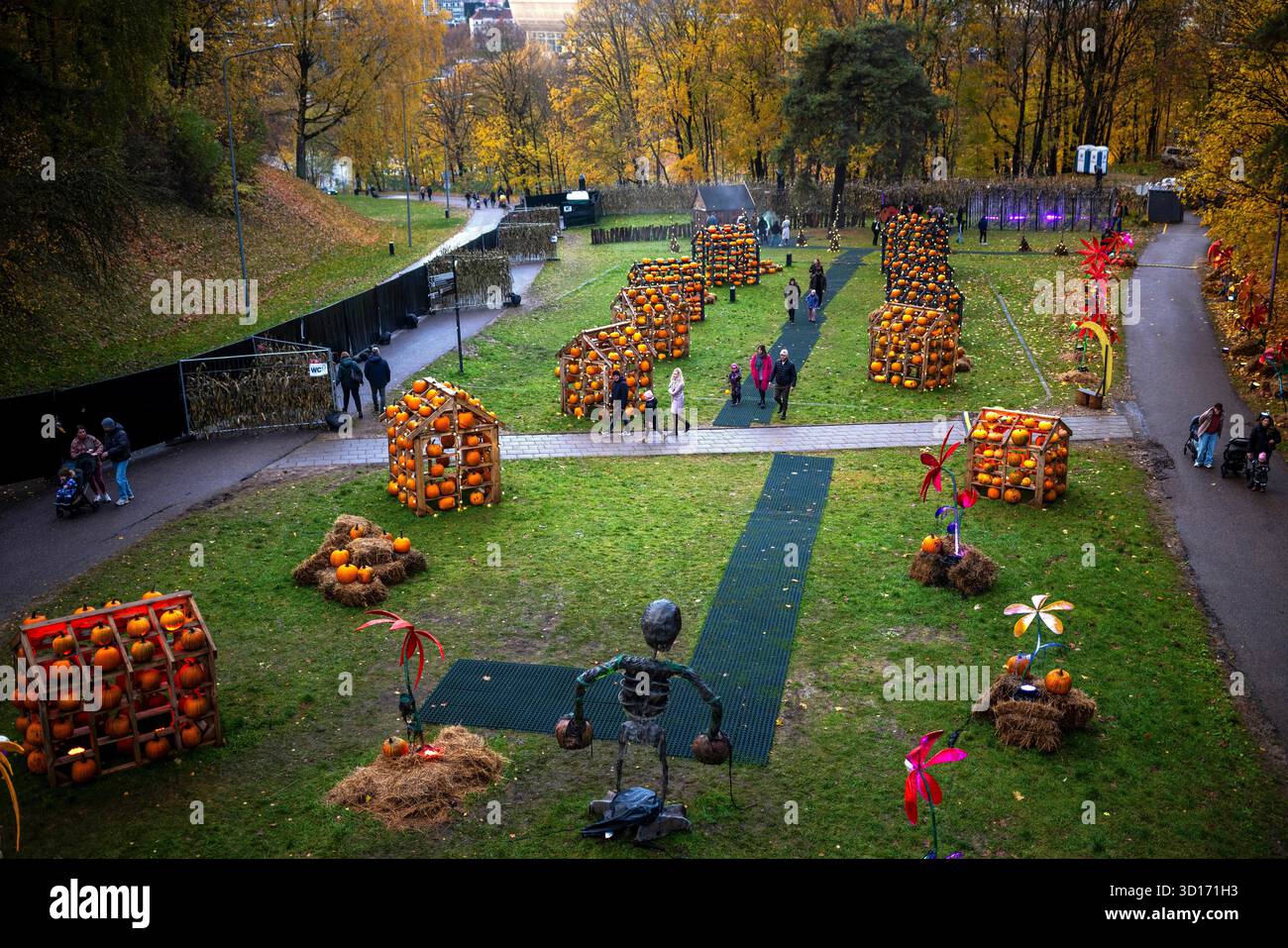 People walk in the Halloween park during a Halloween celebration in ...