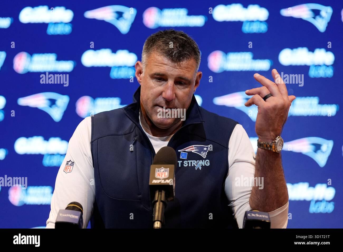 New England Patriots head coach Mike Vrabel answers questions after an ...