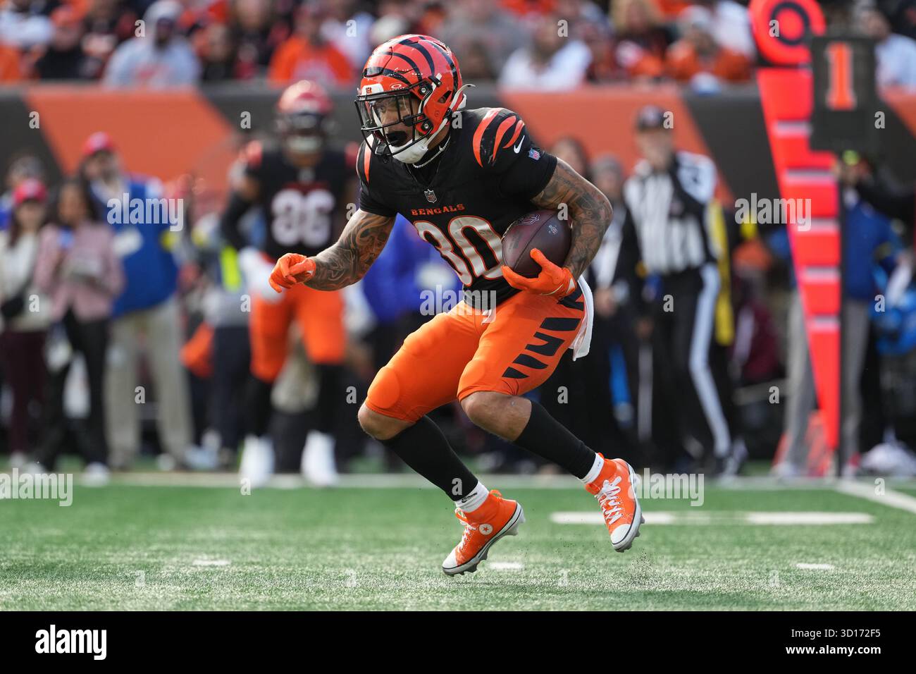 Cincinnati Bengals running back Chase Brown (30) runs after completing ...