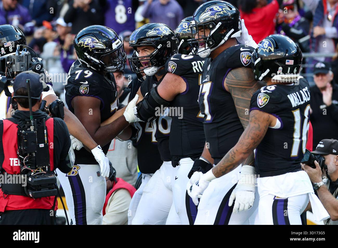 Baltimore Ravens tight end Charlie Kolar, center, celebrates his ...