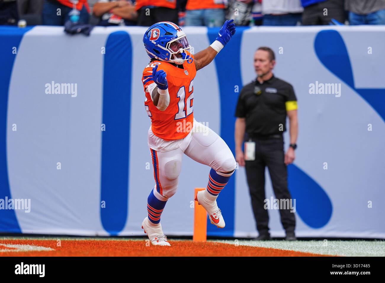 Denver Broncos running back RJ Harvey (12) celebrates his touchdown run ...