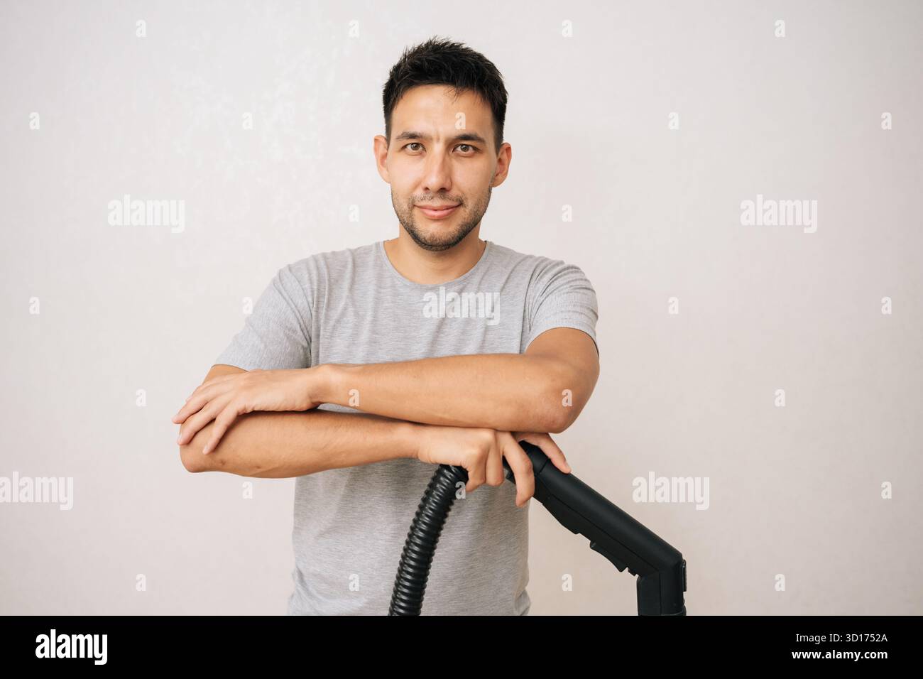 Portrait of friendly cleaning service employee male standing posing ...