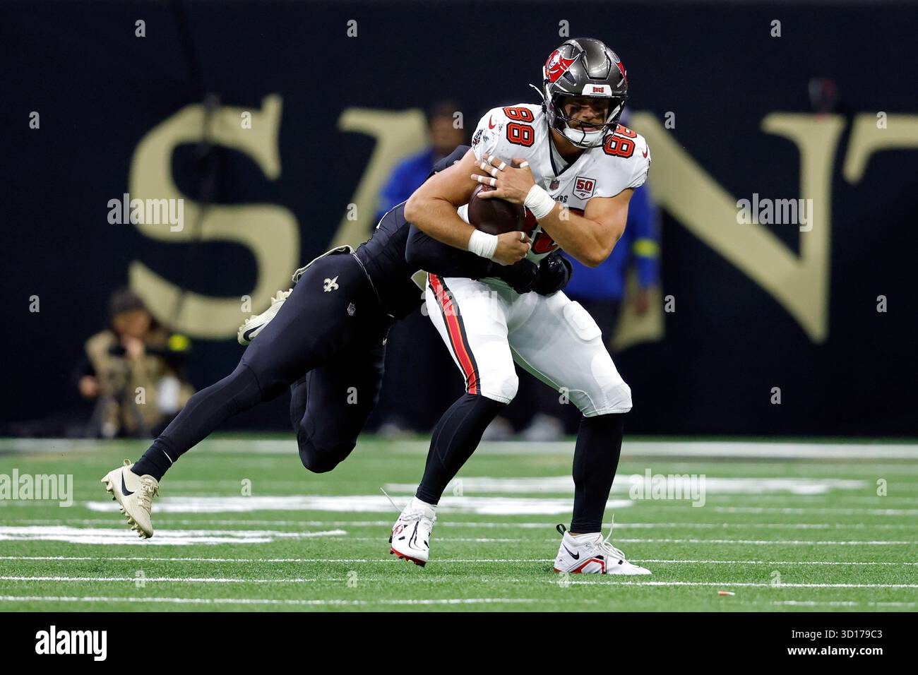 Tampa Bay Buccaneers tight end Cade Otton (88) is tackled by New ...