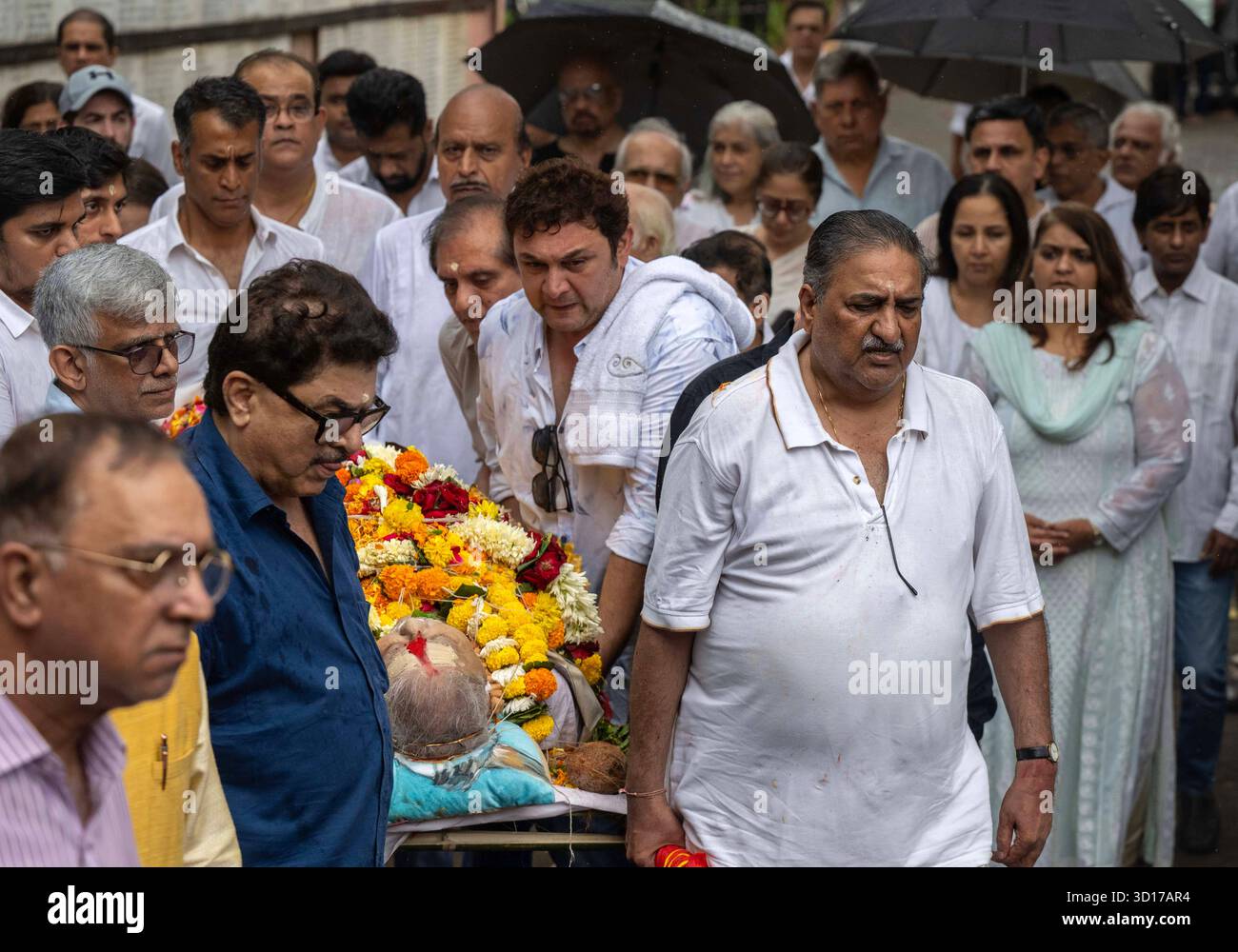 MUMBAI, INDIA - OCTOBER 26: Relatives and friends mourn during the last ...