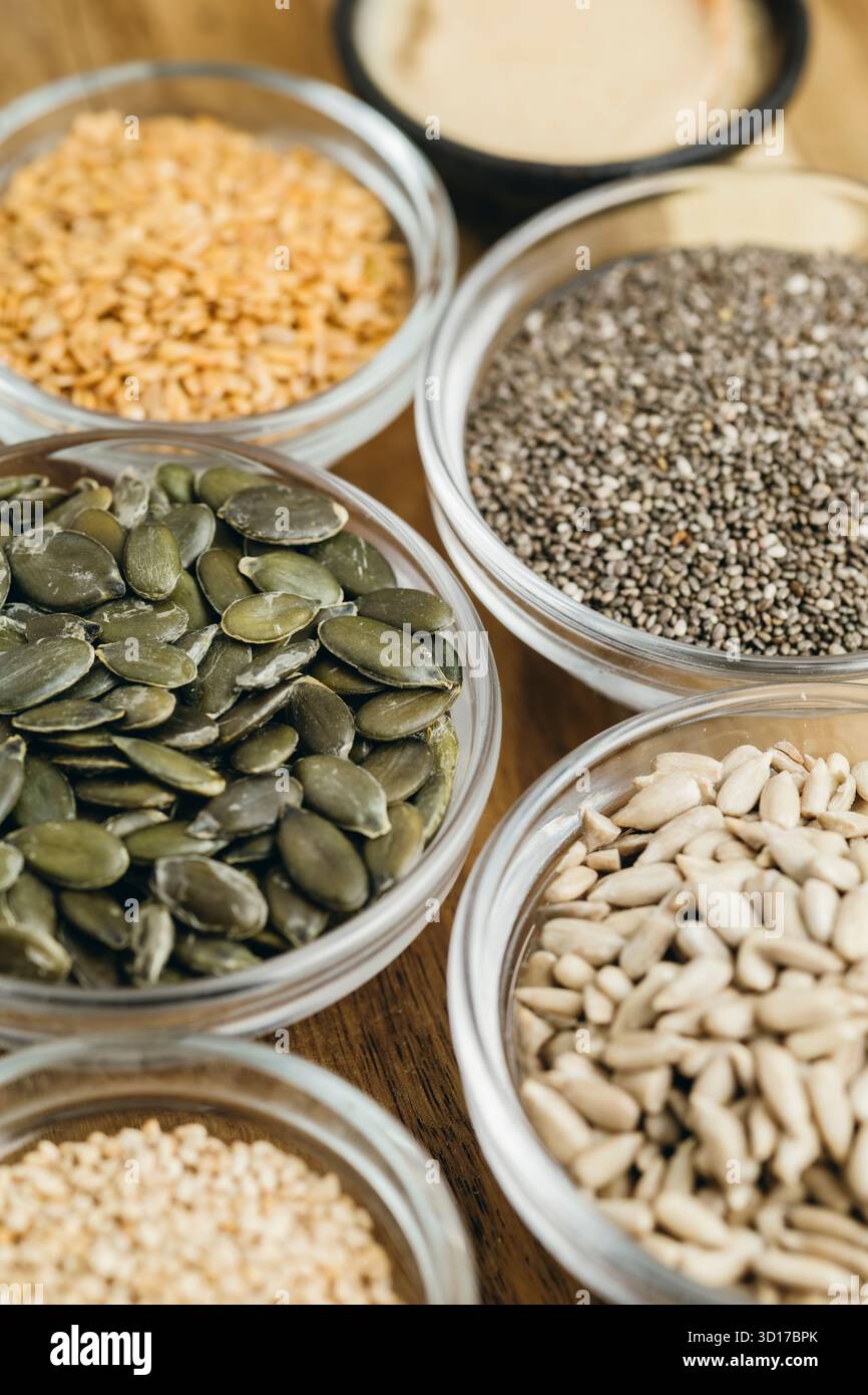 Small bowls filled with different types of seeds — flaxseed, chia ...