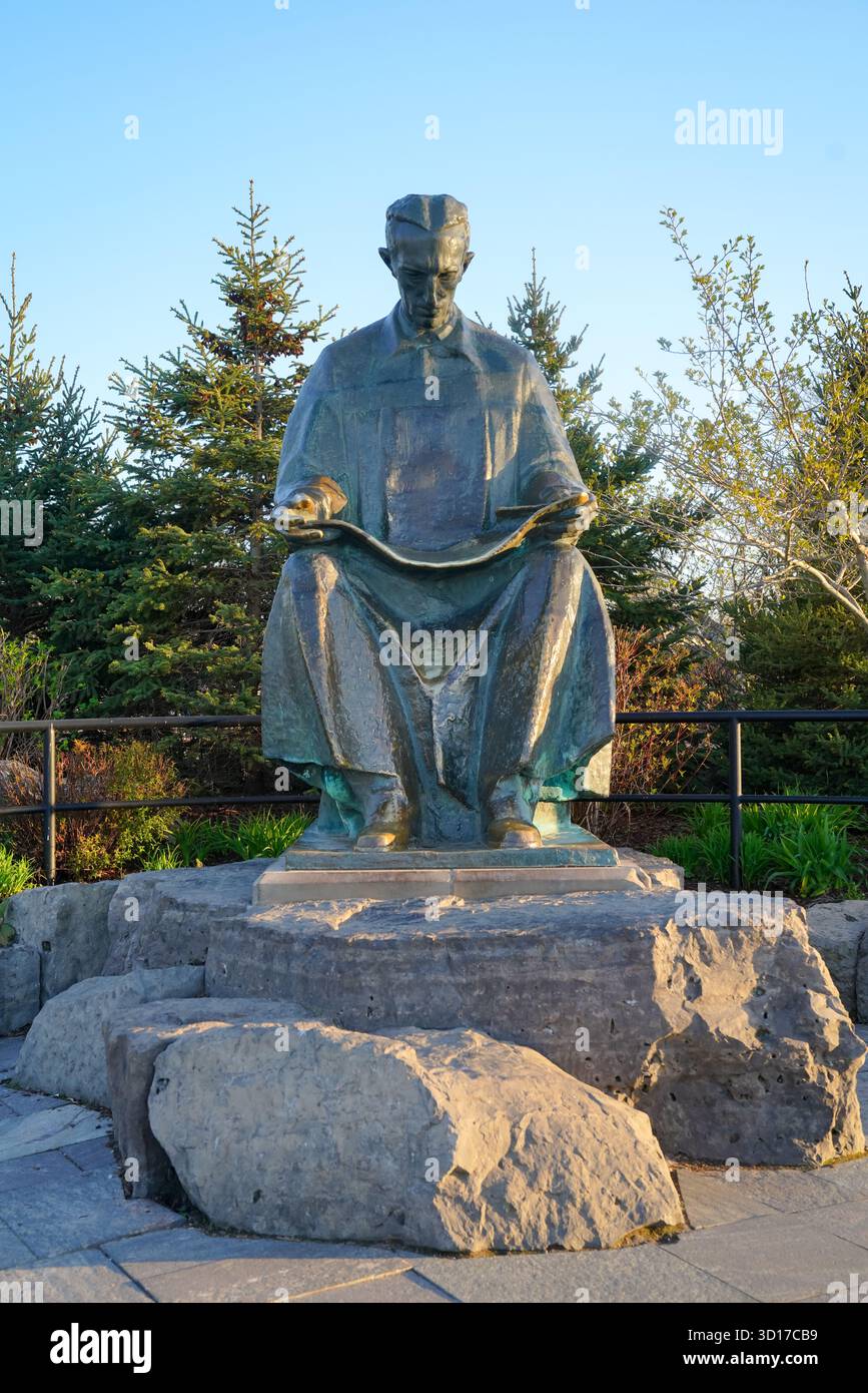 The bronze statue of inventor Nikola Tesla sits on a stone pedestal in ...