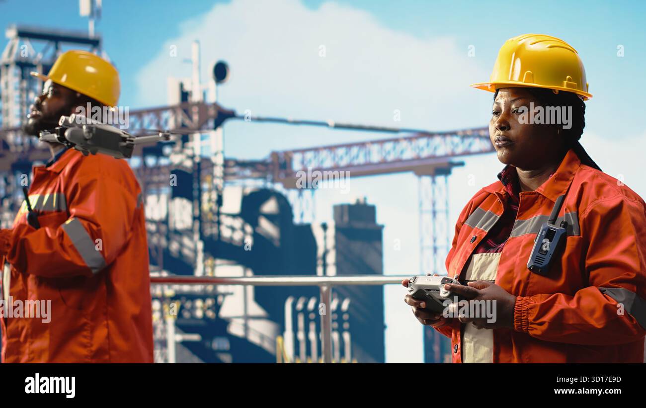 Drilling rig crew engineers piloting inspection drone for quick ...