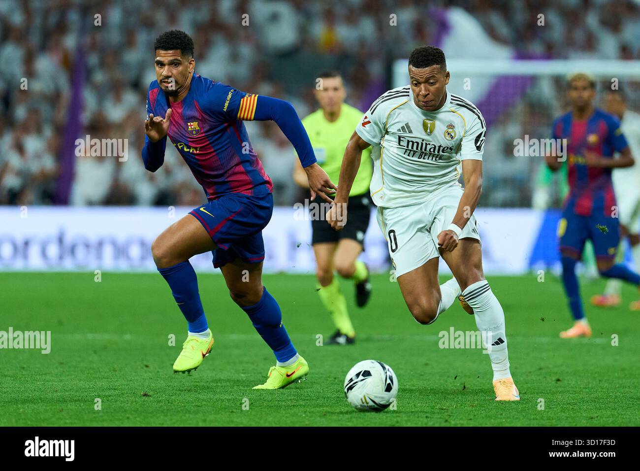 Kylian Mbappe of Real Madrid CF battles for the ball with Ronald Araujo ...