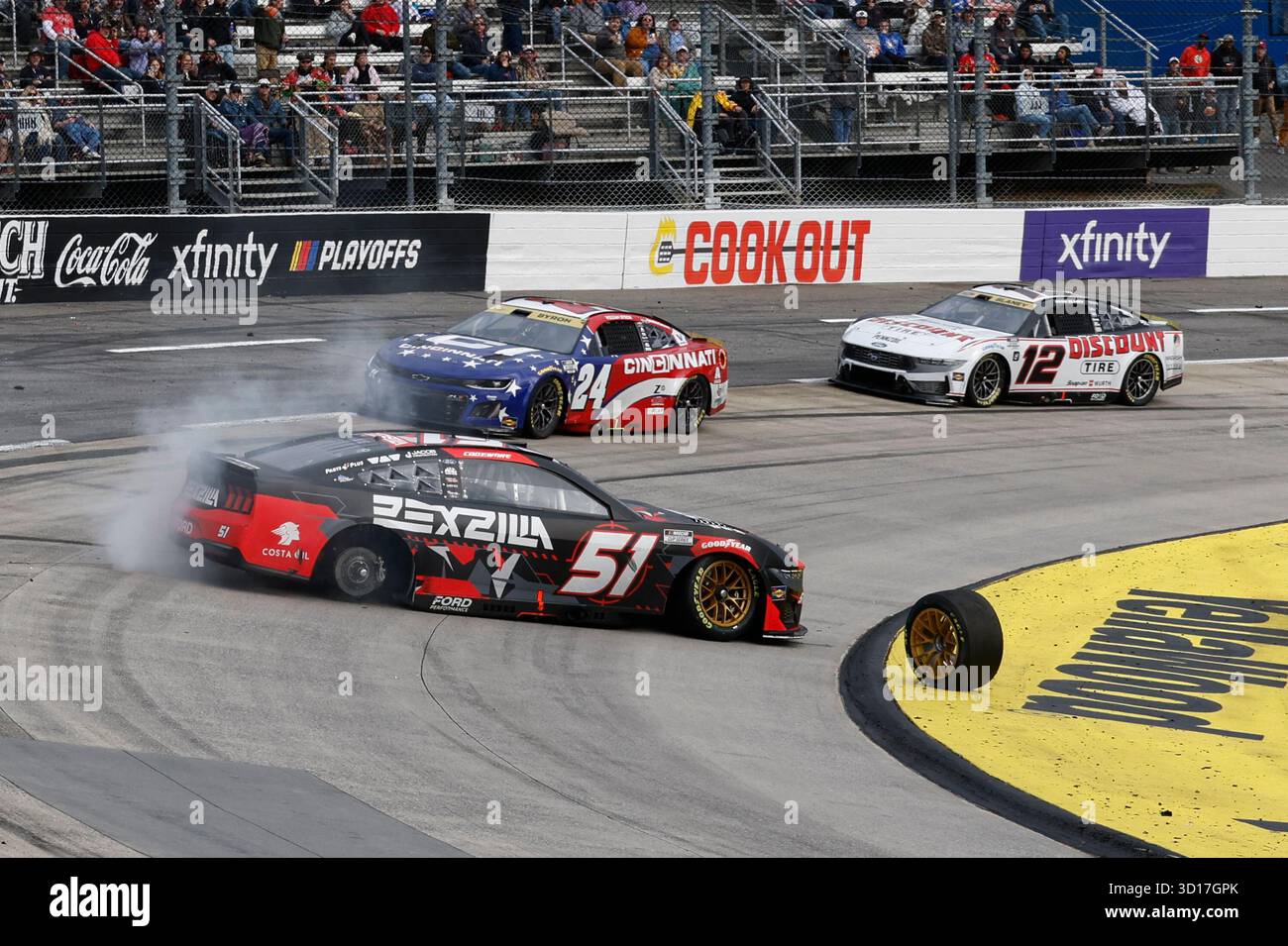 Cody Ware (51) loses a tire as leaders William Byron (24) and Ryan ...