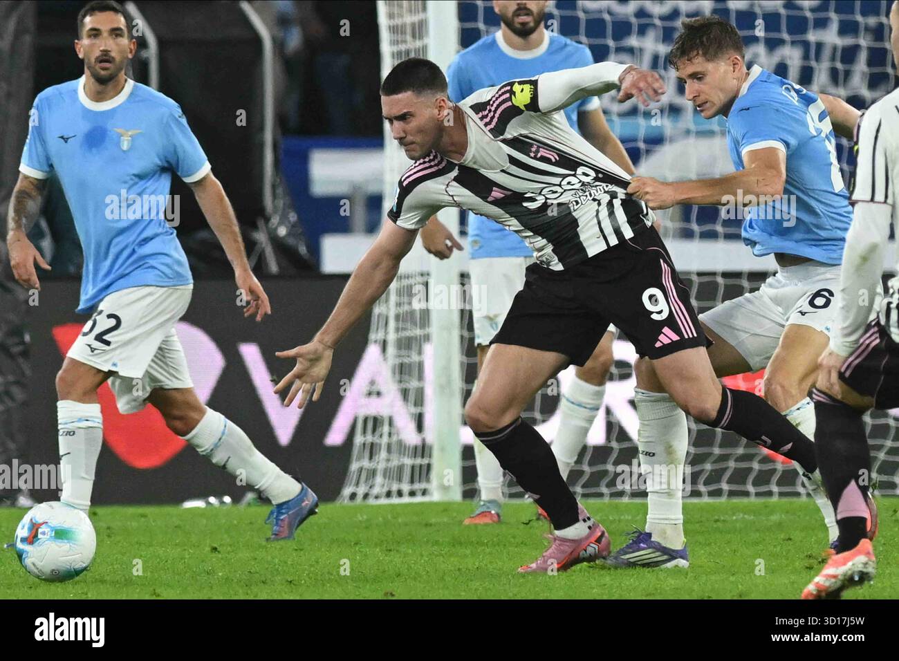 Toma Basic of SS Lazio competes for the ball with Dusan Vlahovic of ...