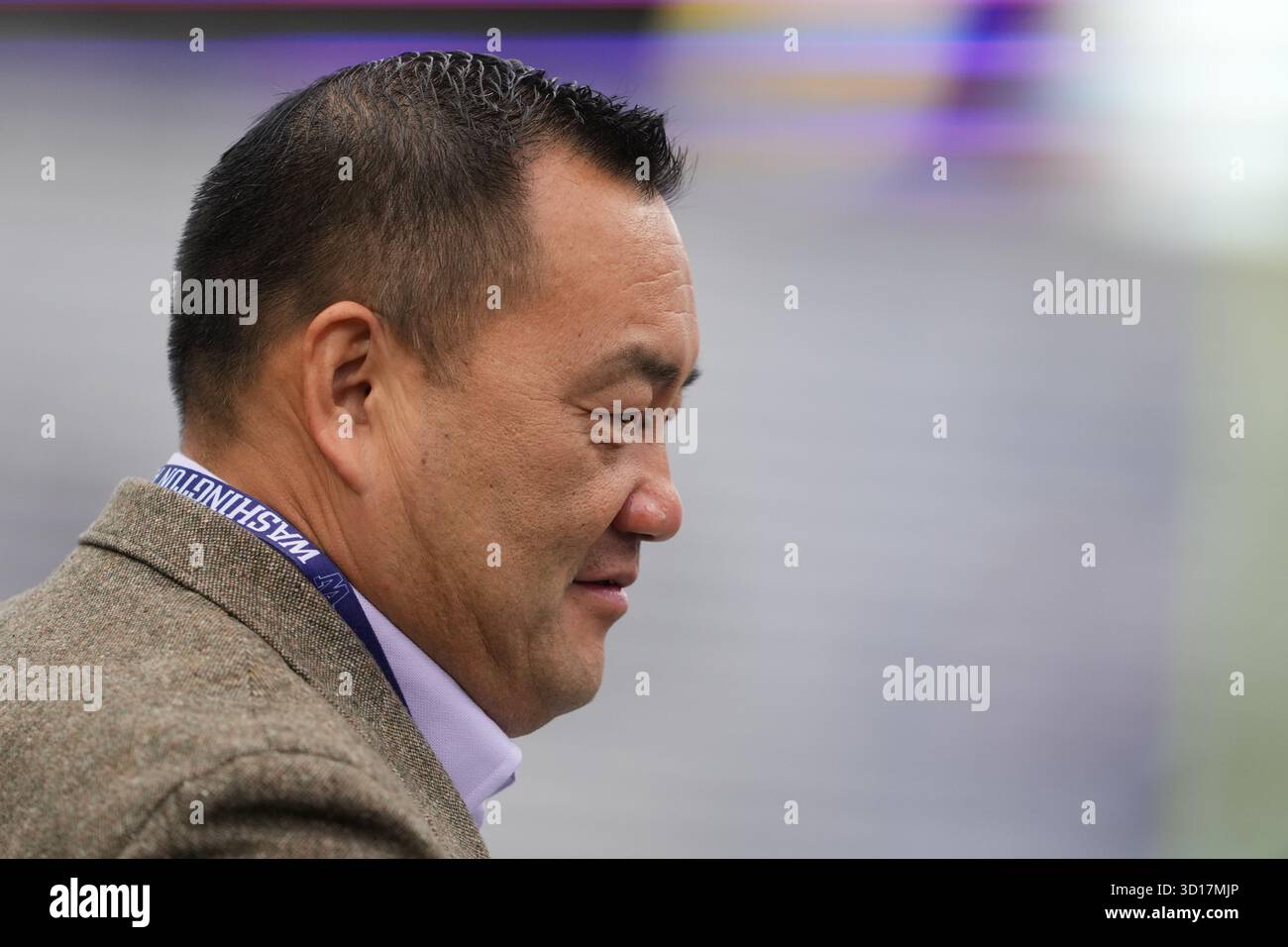 Washington athletic director Pat Chun walks on the sidelines during ...