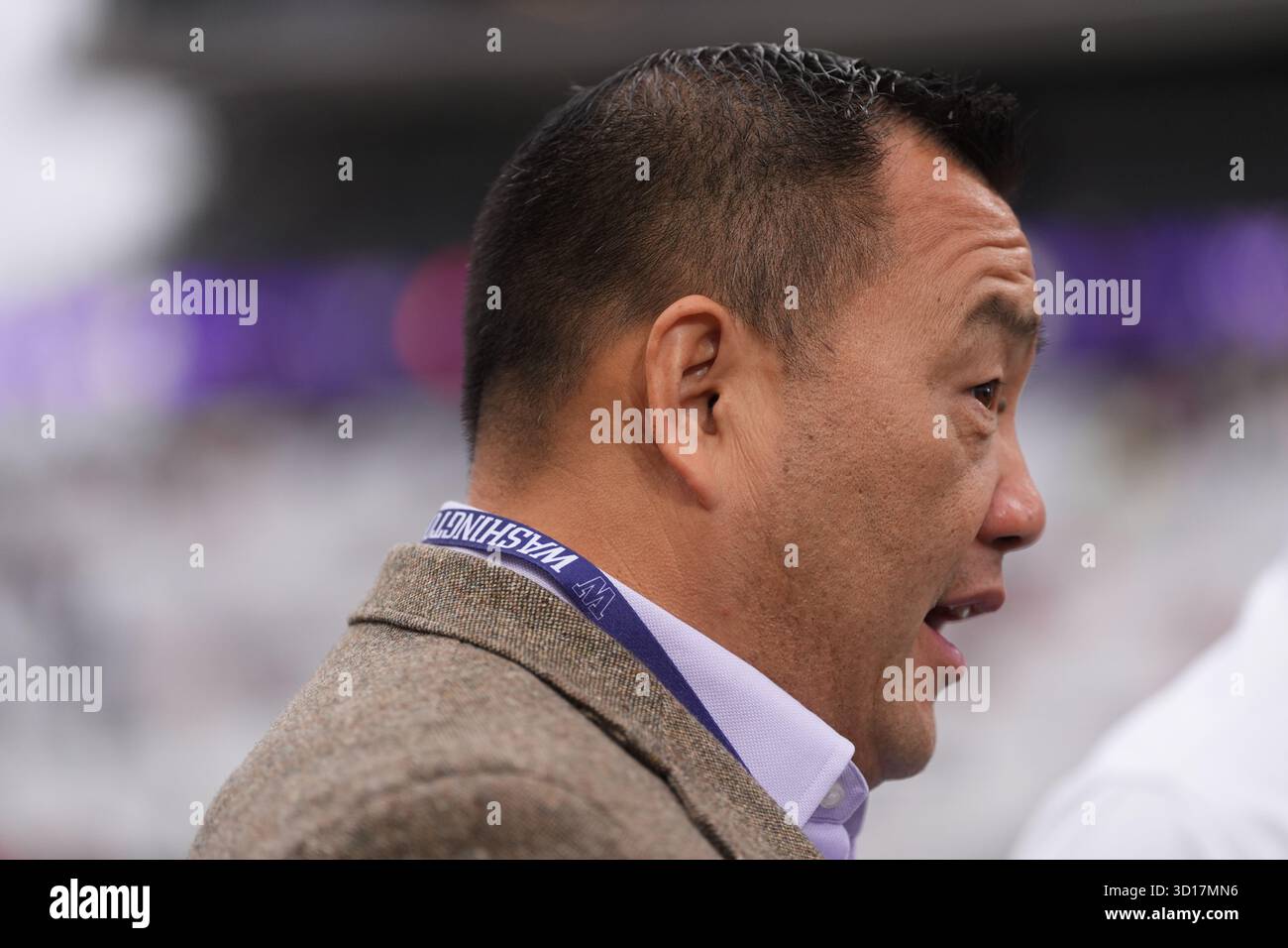 Washington athletic director Pat Chun on the sideline before an NCAA ...