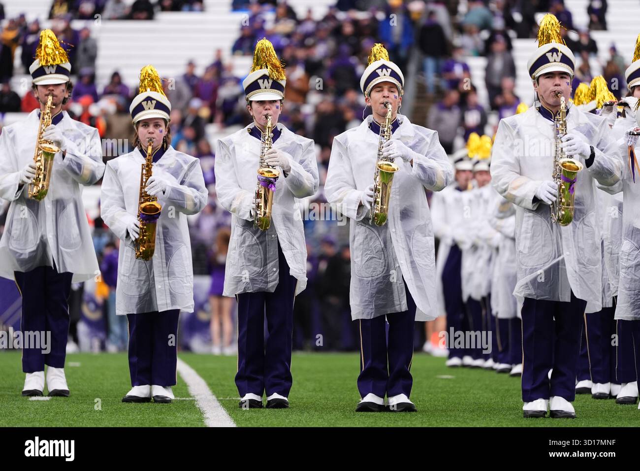 The Husky Marching Band performs before an NCAA college football game ...