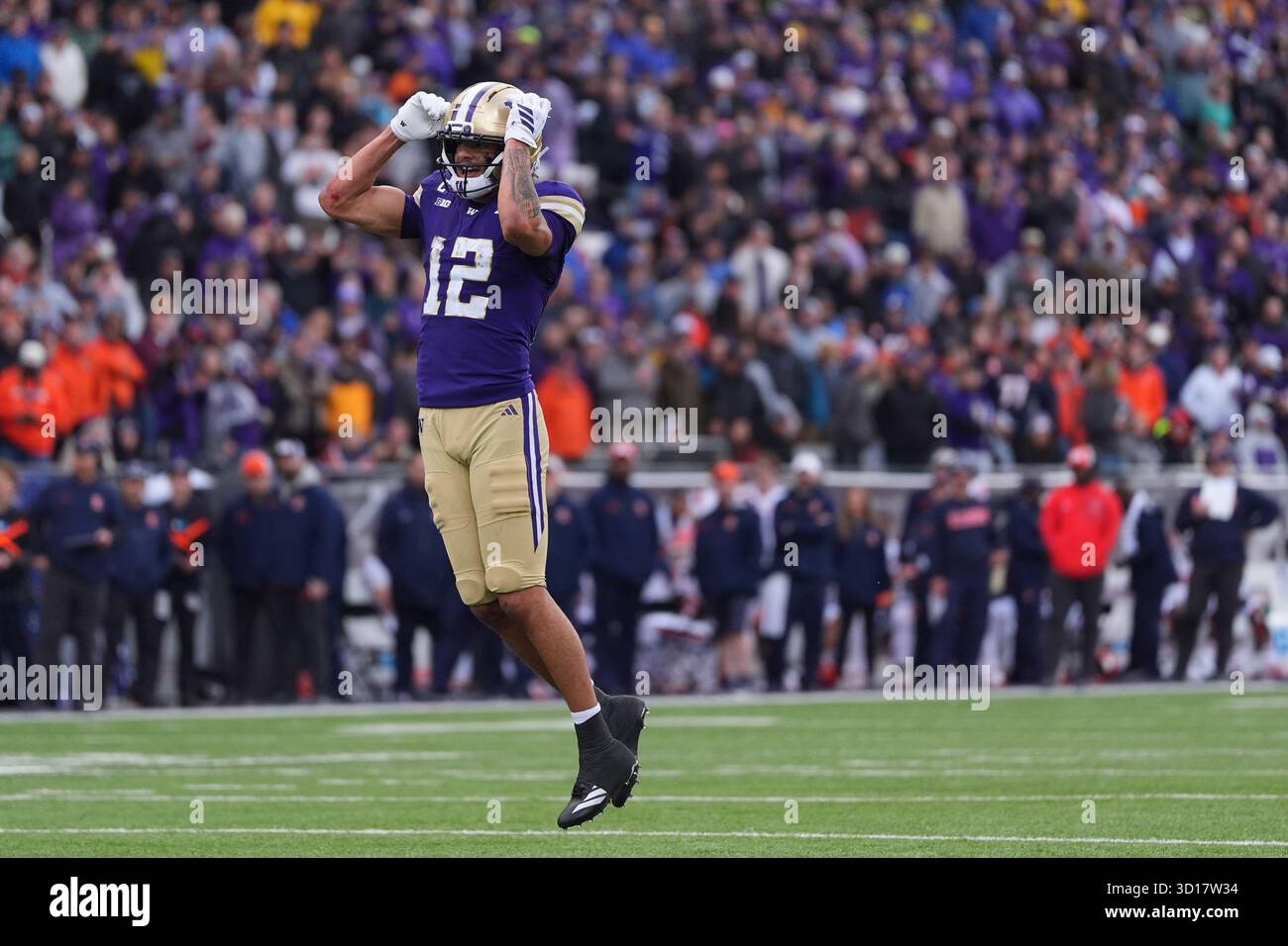 Washington wide receiver Denzel Boston reacts during an NCAA college ...
