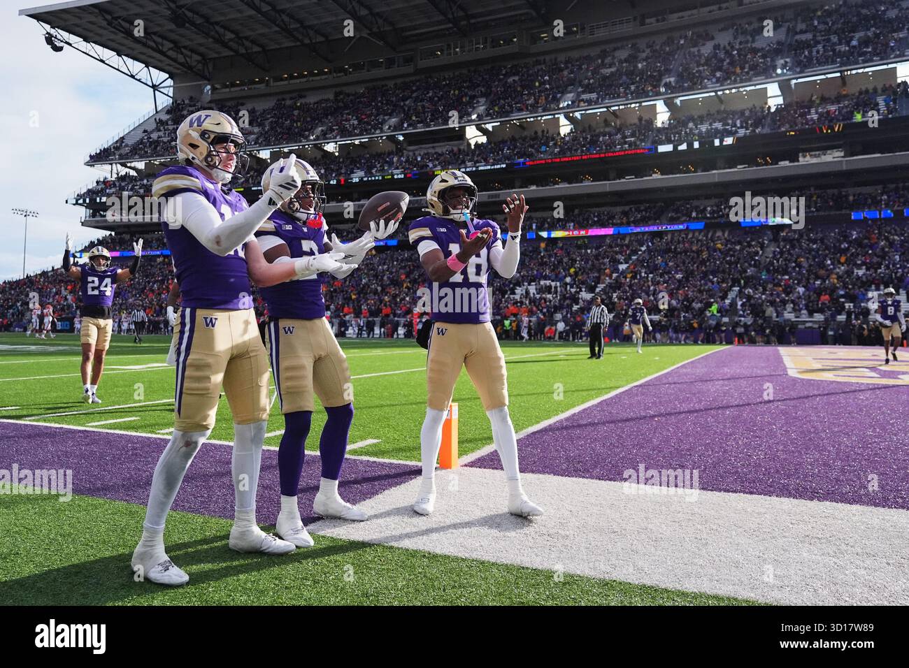 Washington safety Alex McLaughlin (12), safety Rahshawn Clark (2) and ...