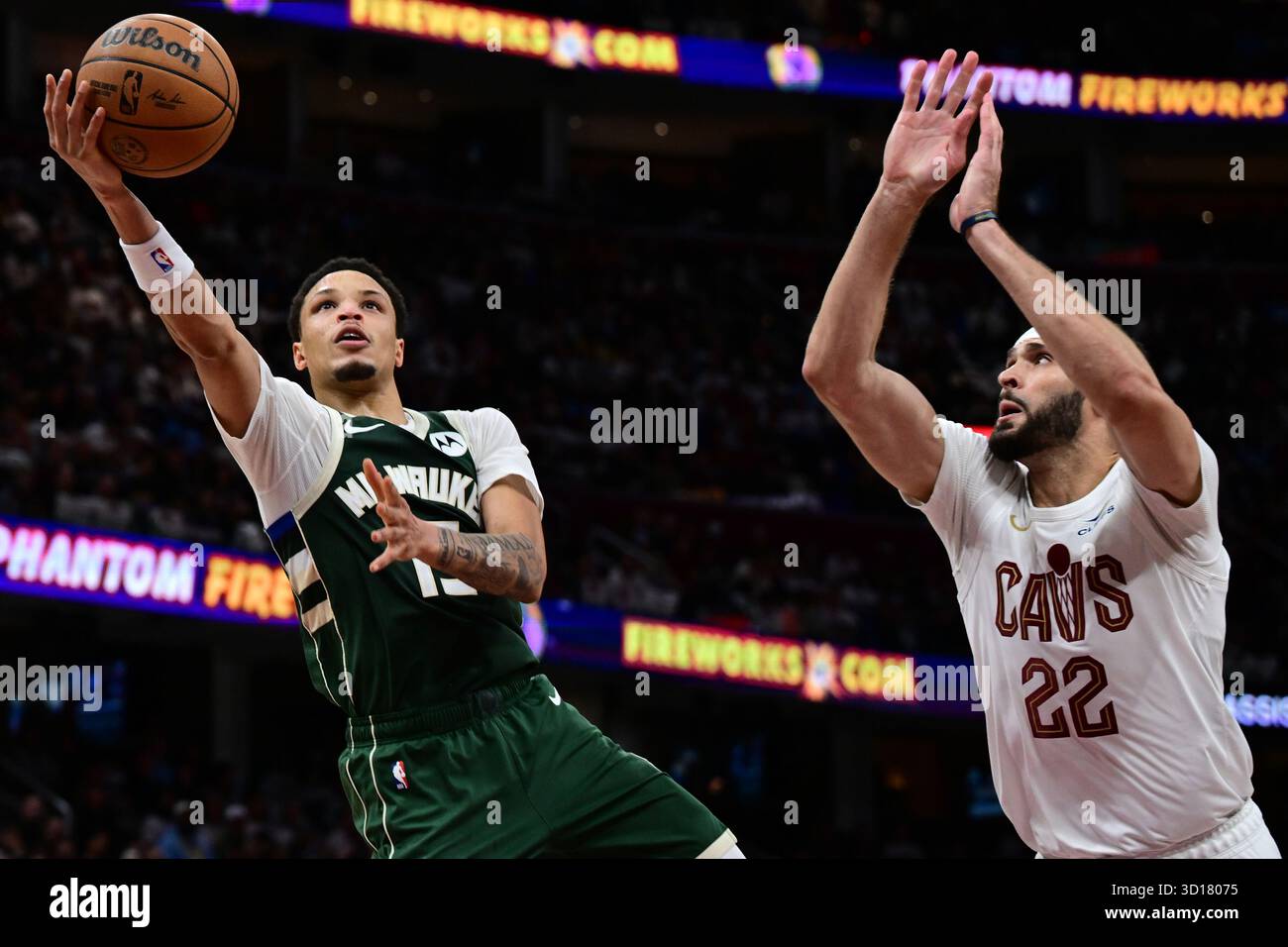 Milwaukee Bucks guard Ryan Rollins, left, goes to the basket against ...