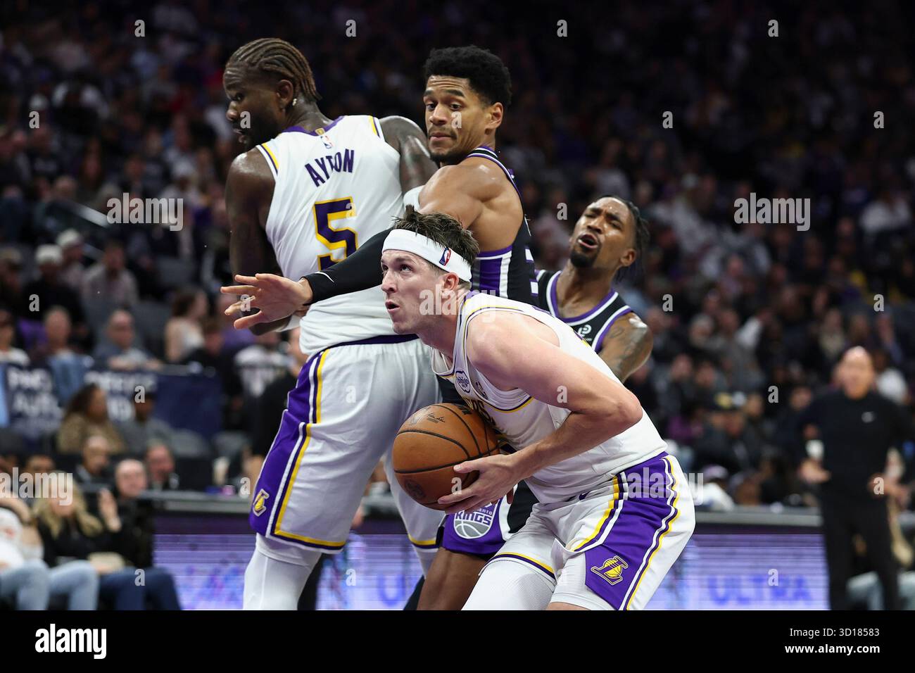 Los Angeles Lakers guard Austin Reaves, center foreground, draws a foul ...