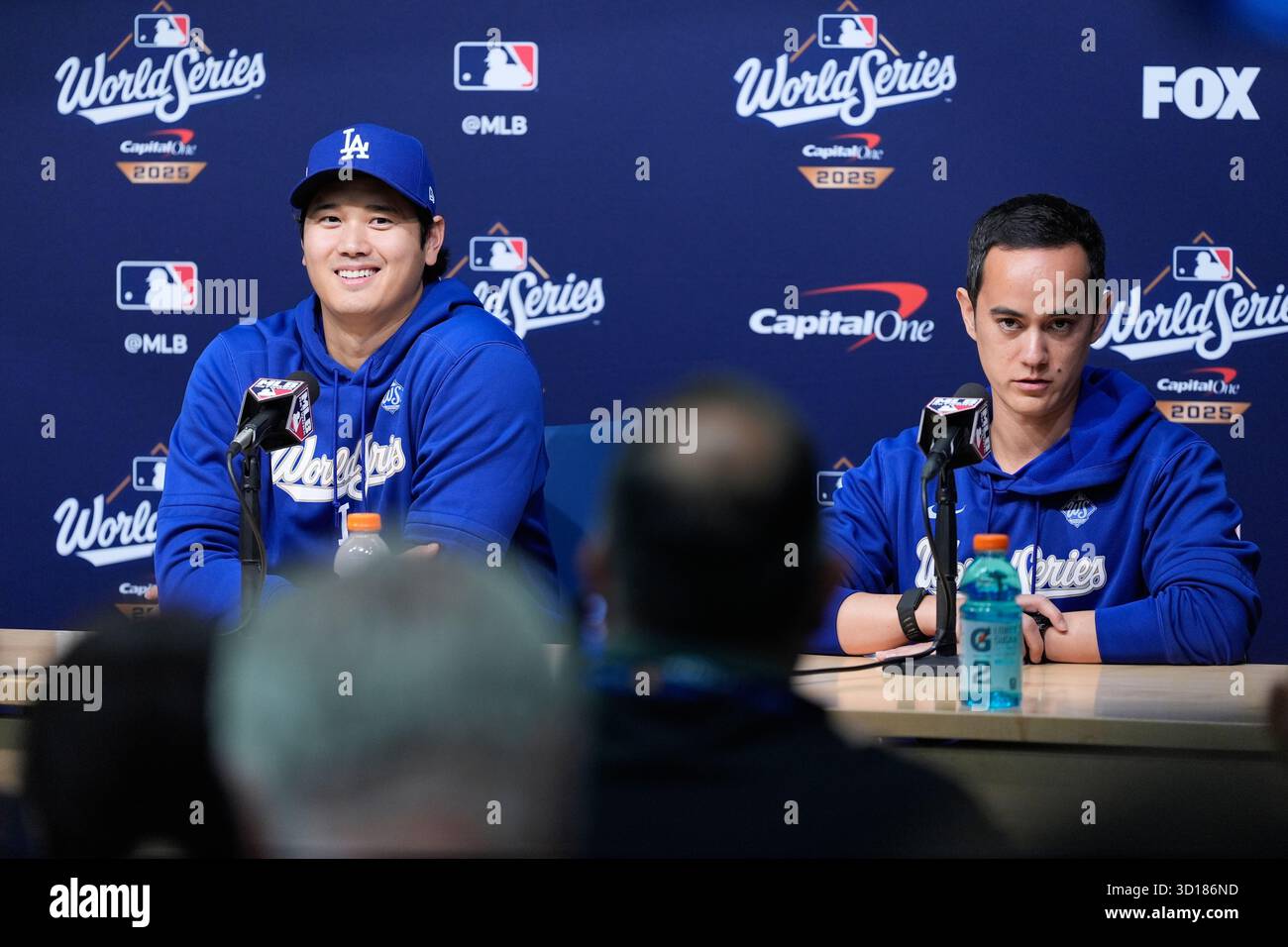 Los Angeles Dodgers' Shohei Ohtani speaks with his interpreter, Will ...