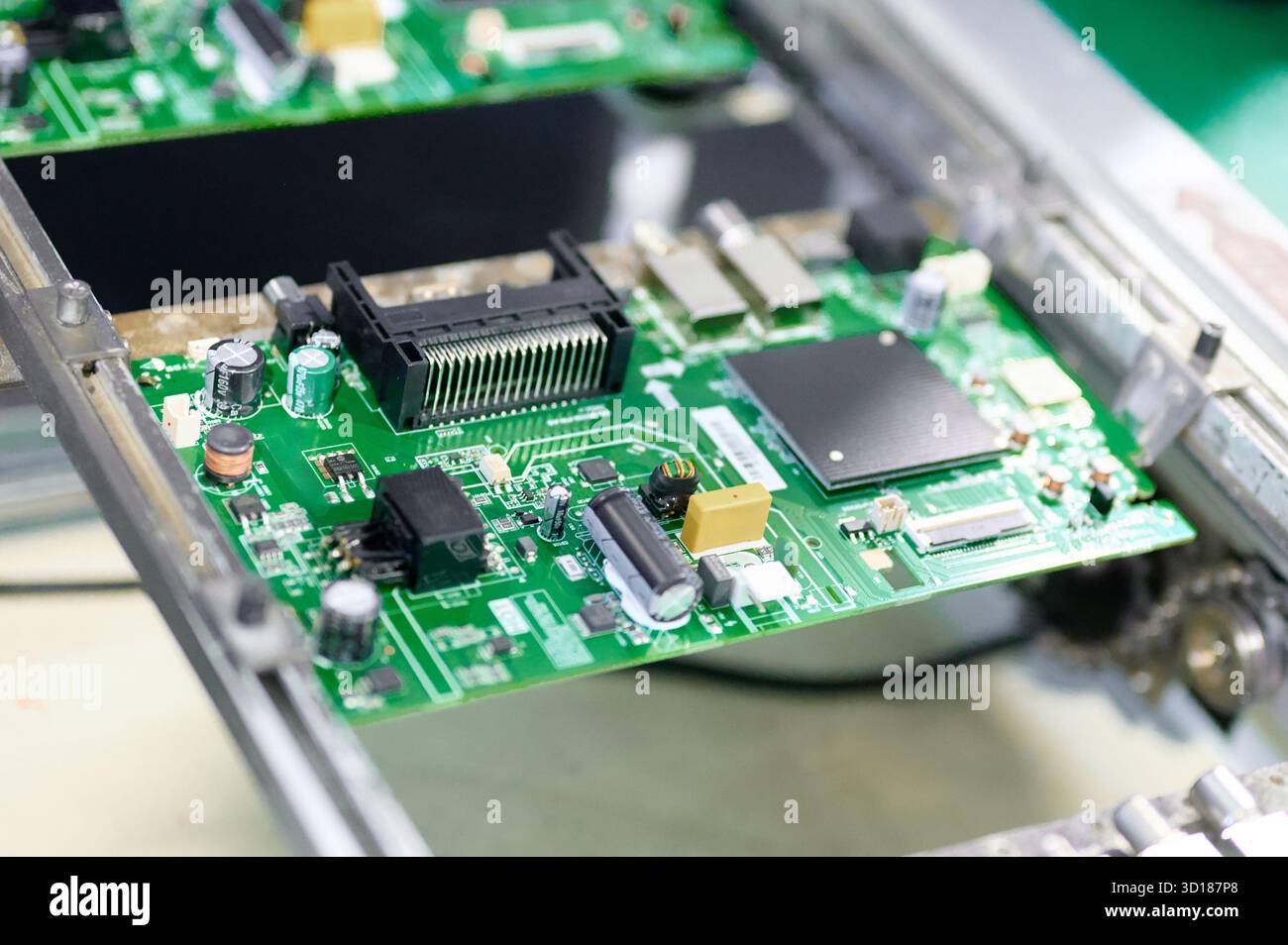 Conveyor transporting electronic boards in a manufacturing facility ...