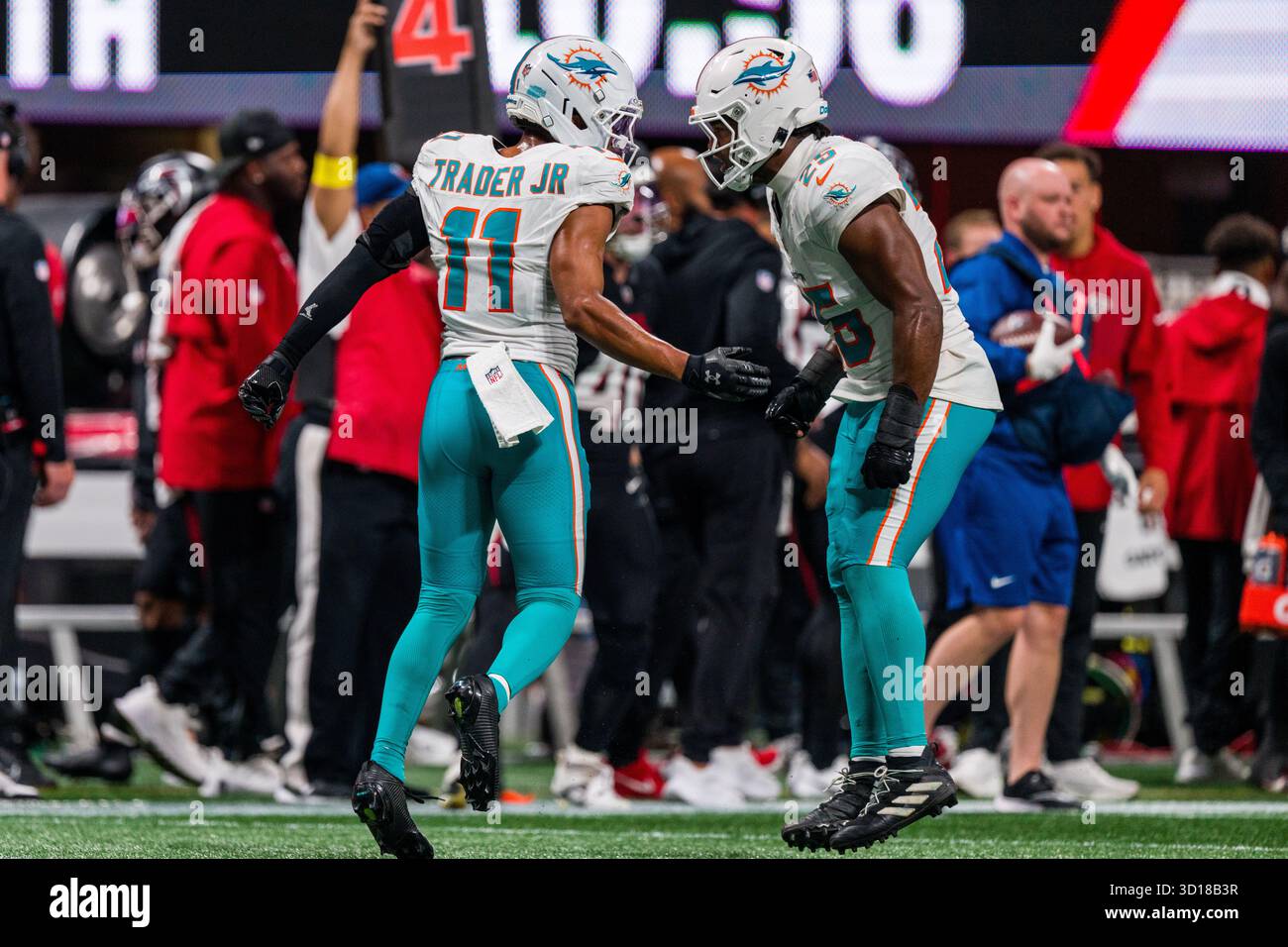 Miami Dolphins safety Dante Trader Jr. (11) celebrates with linebacker ...