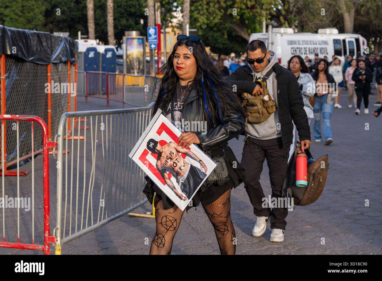 A fan carries a poster of Puerto Rican rapper Residente before his ...