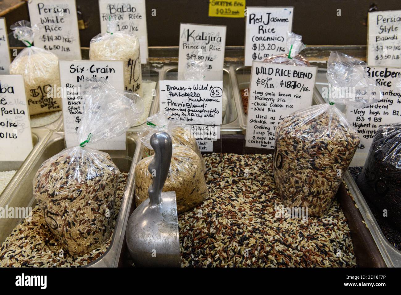Rice stall at a farmer's market featuring a wide variety of rice ...