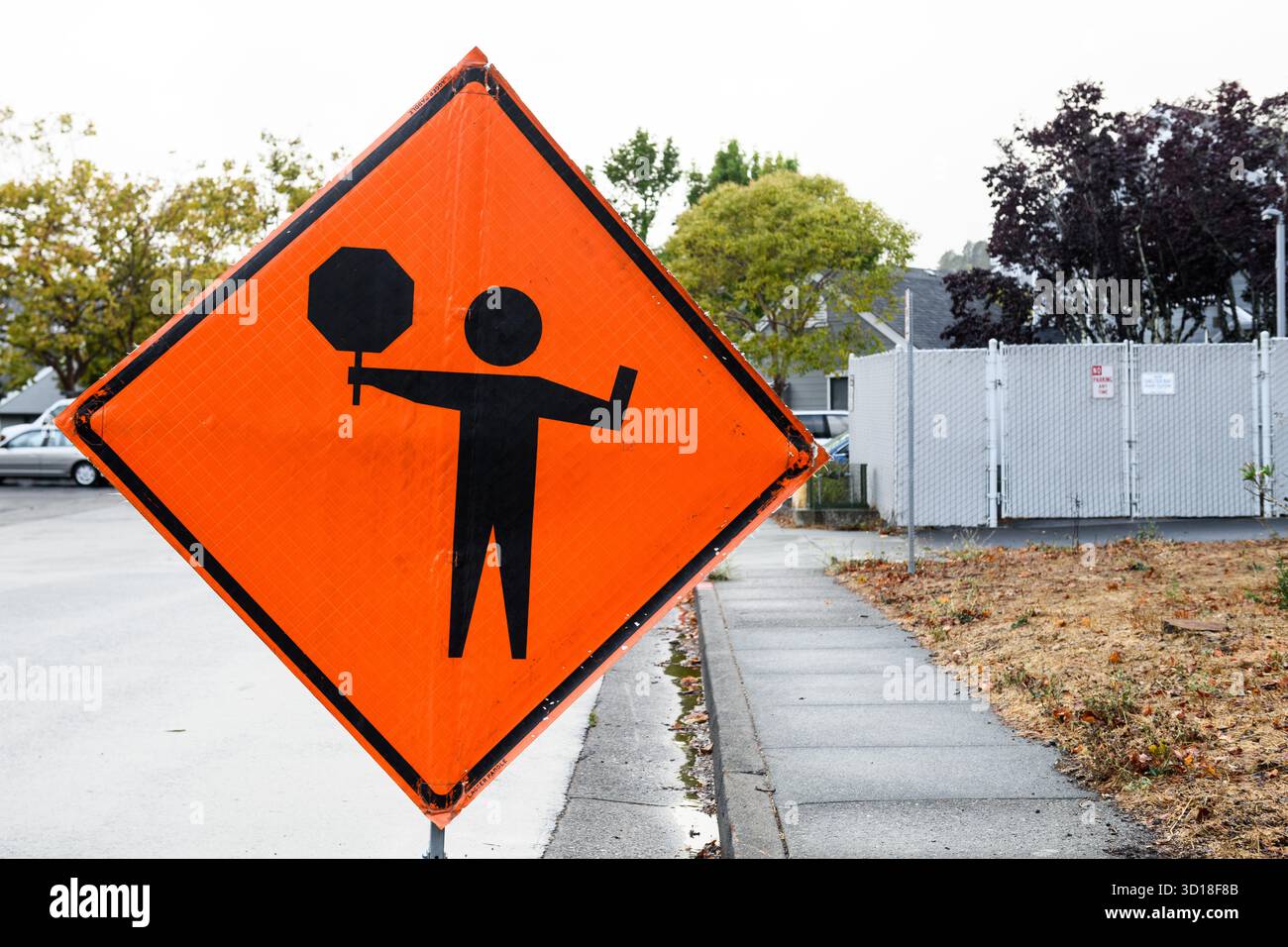 Orange, traffic warning sign alerting motor vehicles of road work ahead ...