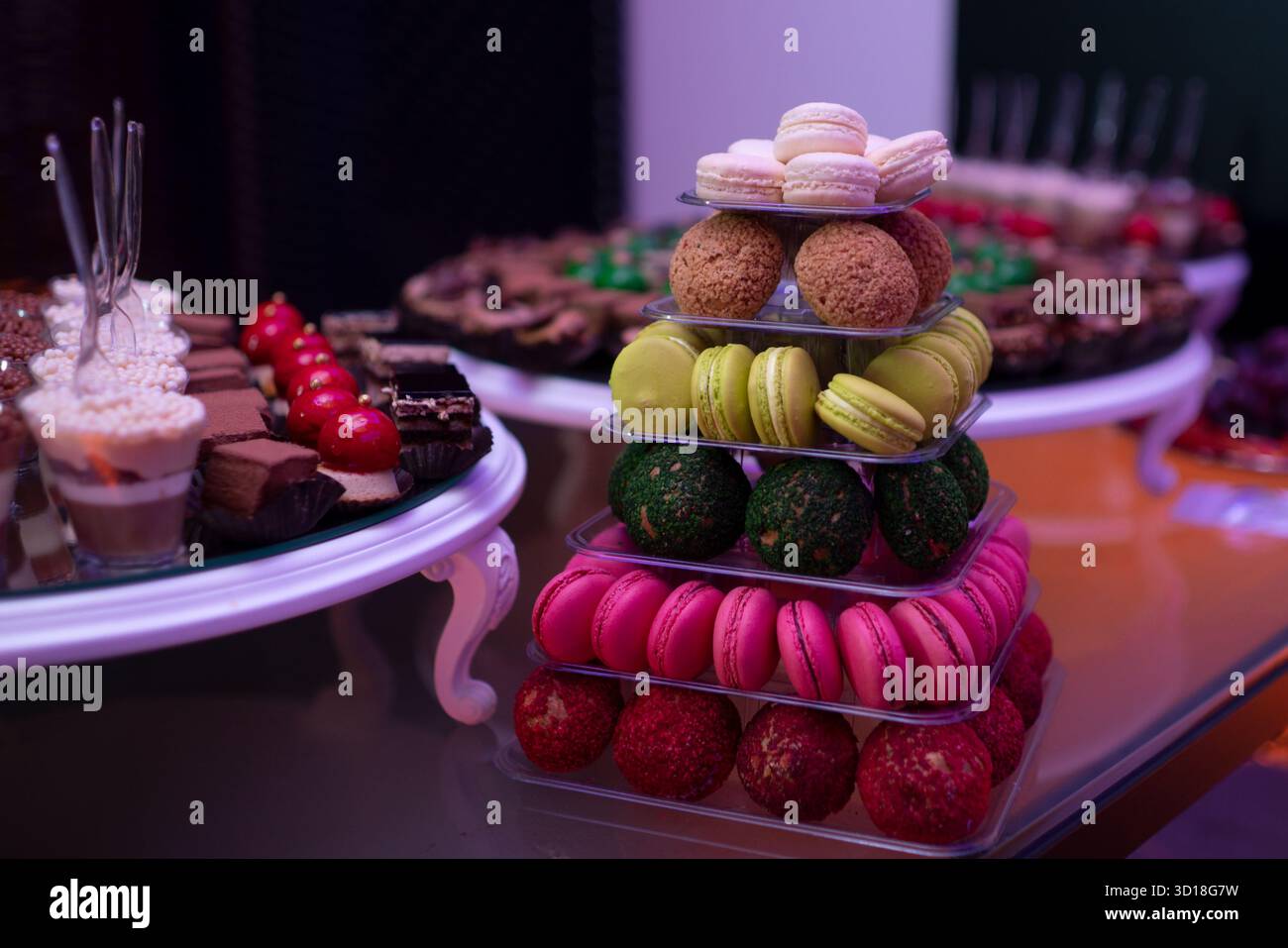 Colorful macarons and desserts on elegant buffet table. Luxury sweets ...