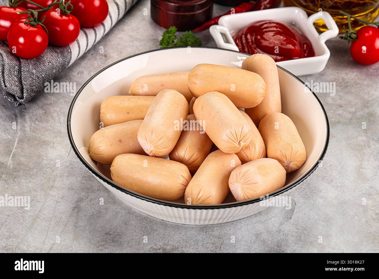 Dietary baby mini chicken sausage in the bowl with ketchup Stock Photo ...