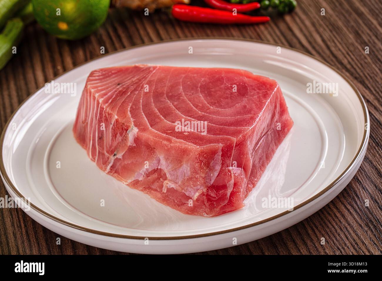 Raw fresh uncooked red tuna steak fillet Stock Photo - Alamy