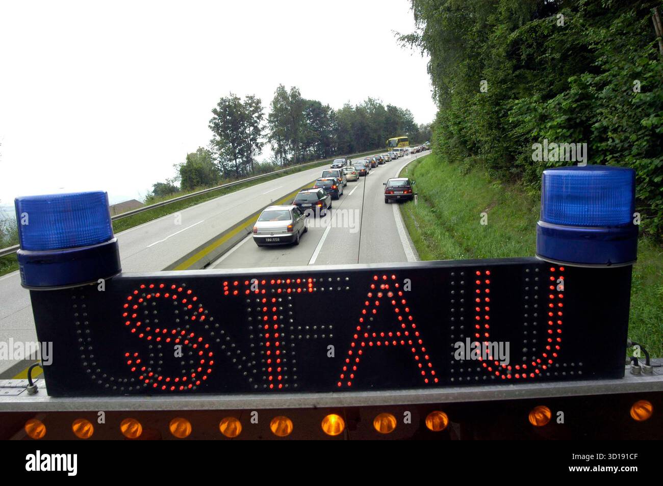 a traffic congestion warning road sign standing on the street traffic ...
